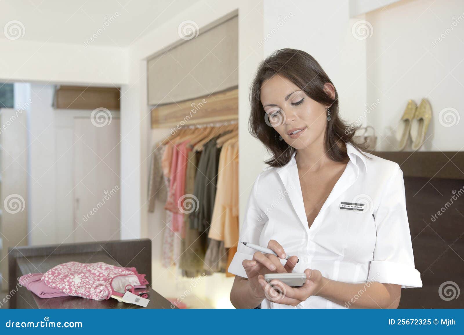 Shop Attendant on Phone stock image. Image of interior - 25672325