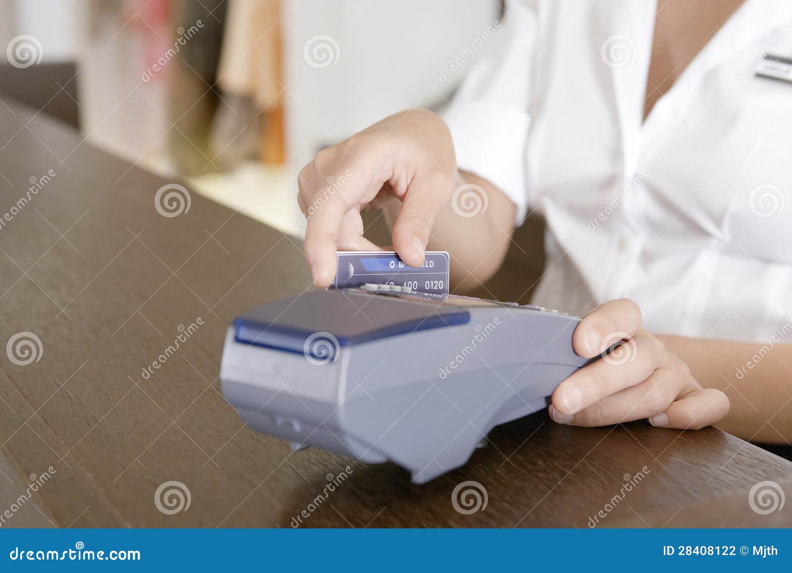 Shop Attendant Sweeping Credit Card at Store Counter Stock Photo ...