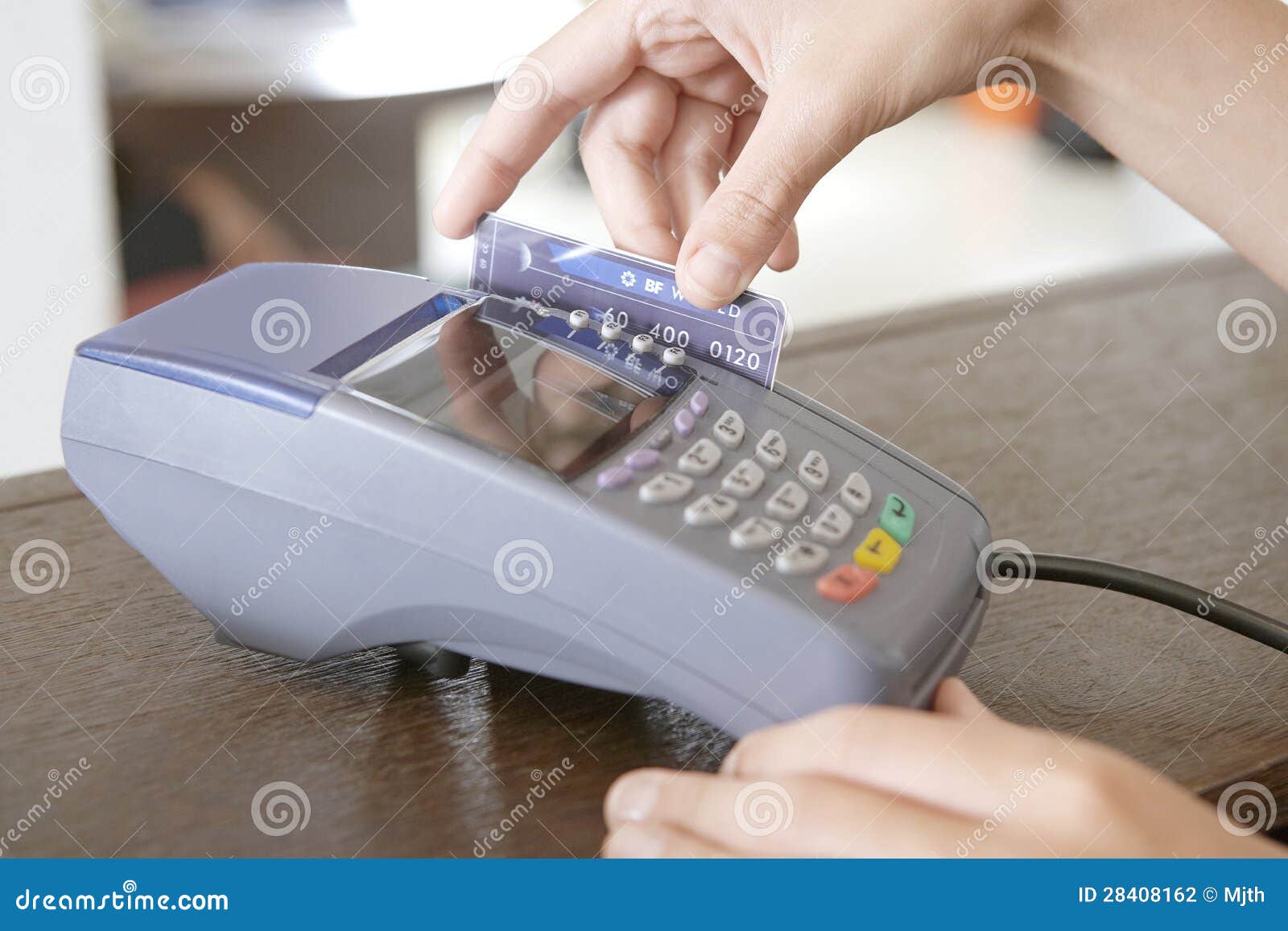 Shop Attendant Sweeping Credit Card at Store Counter Stock Photo ...
