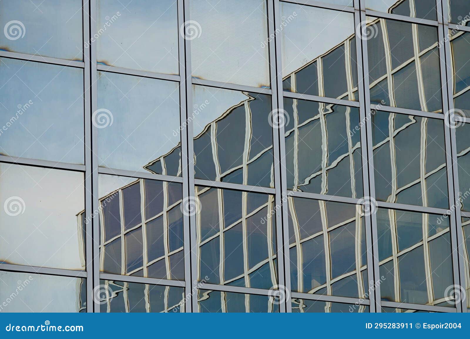 Shop Windows of a Large Office Building with a Reflection of the Sky ...