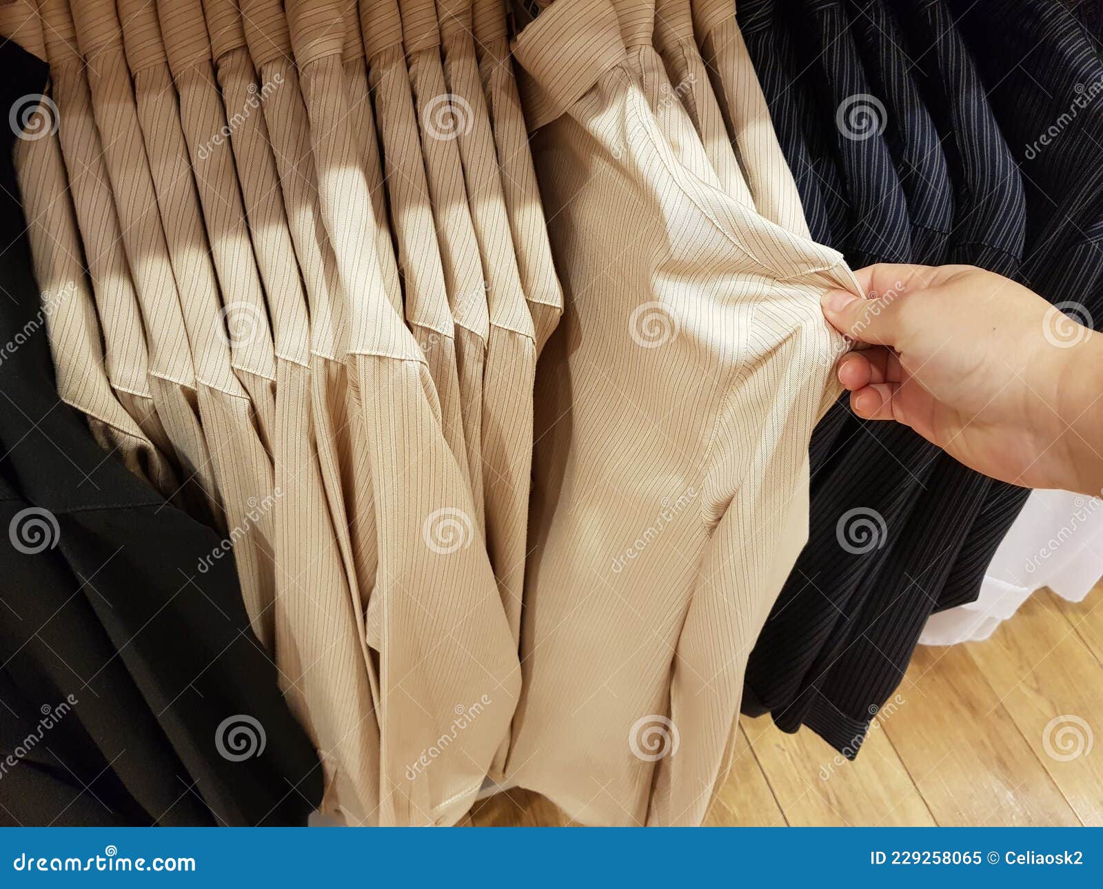 Shopper Browsing and Feeling the Fabric Texture before Purchase Stock ...