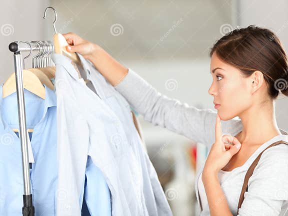 Shopper Choosing Clothes Thinking Stock Photo - Image of elegant ...