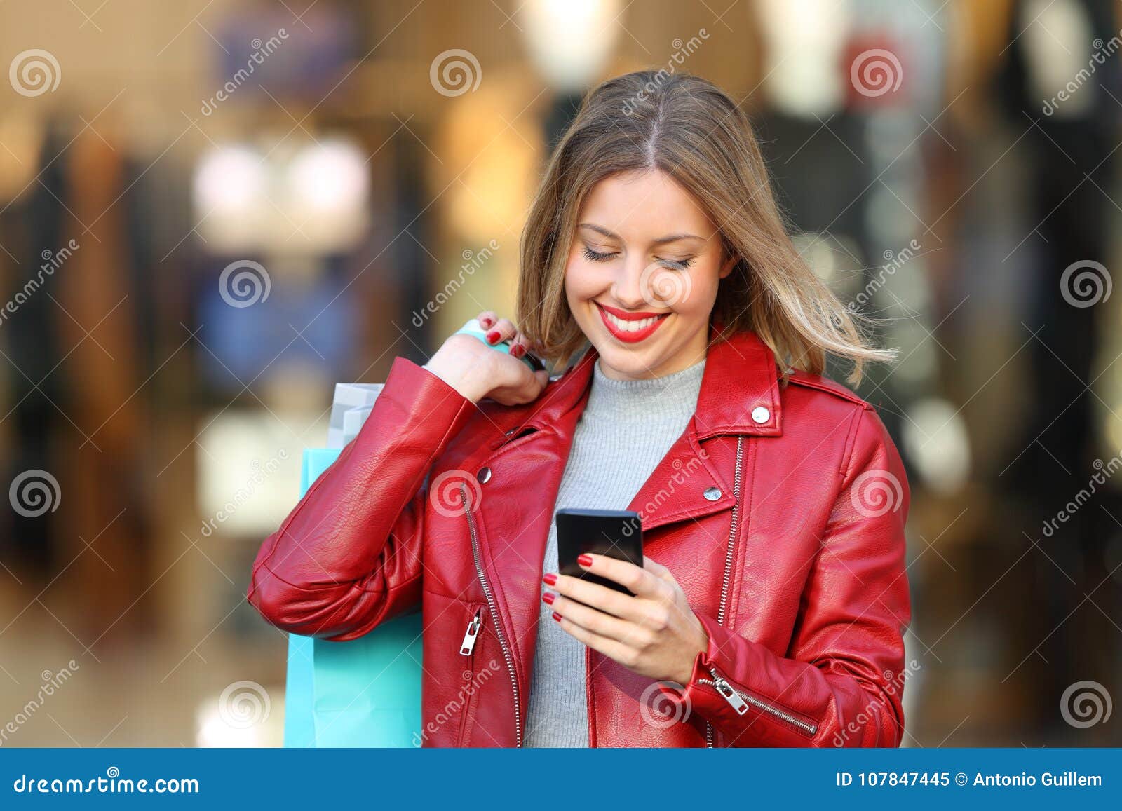 Shopper Shopping and Using a Smart Phone in a Mall Stock Image - Image ...