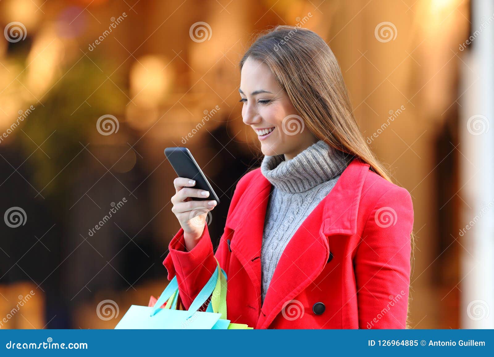 Shopper Using a Smart Phone in a Mall Stock Image - Image of consulting ...