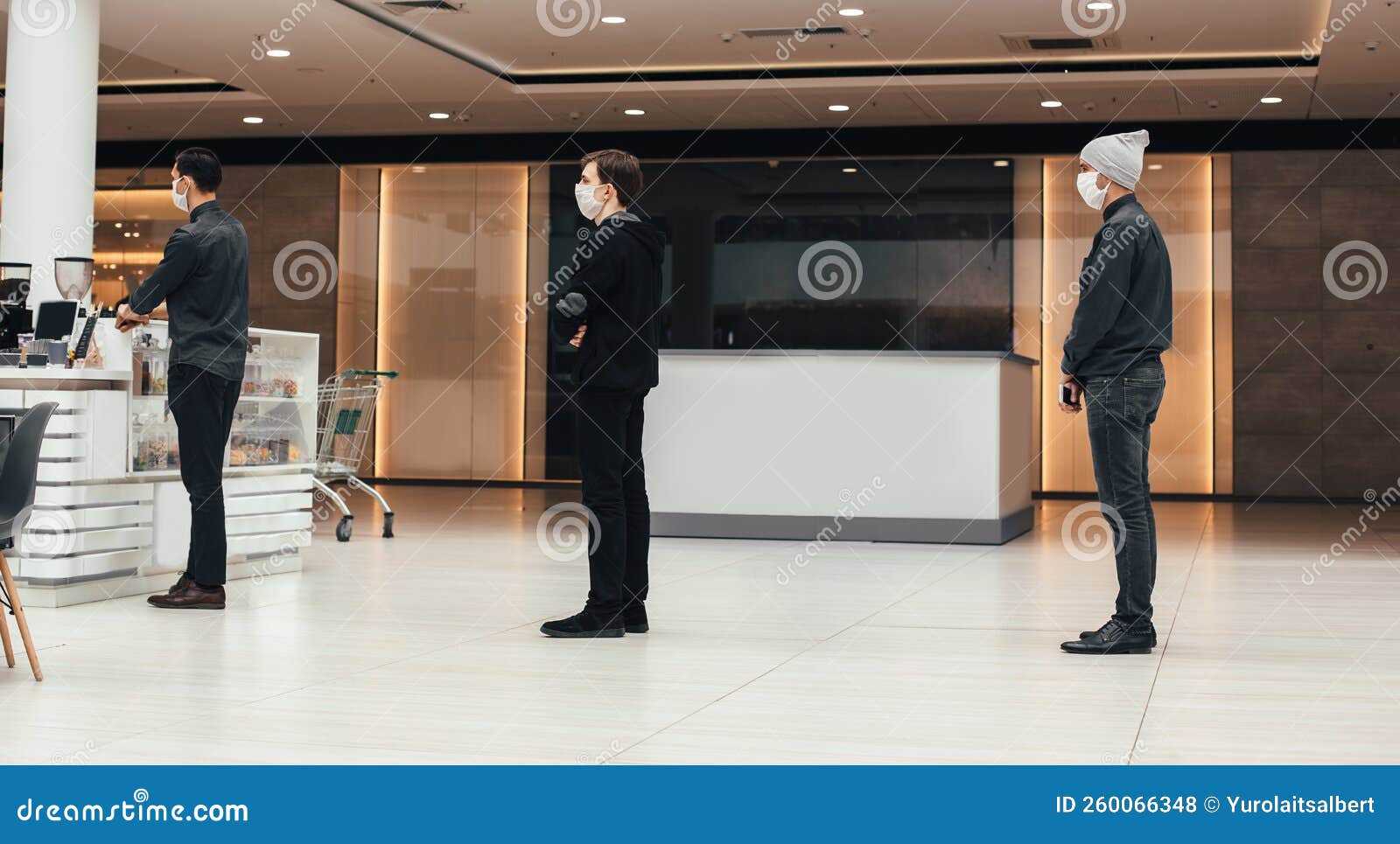 Shoppers in Protective Masks Standing in a Queue in a Supermarket Stock ...
