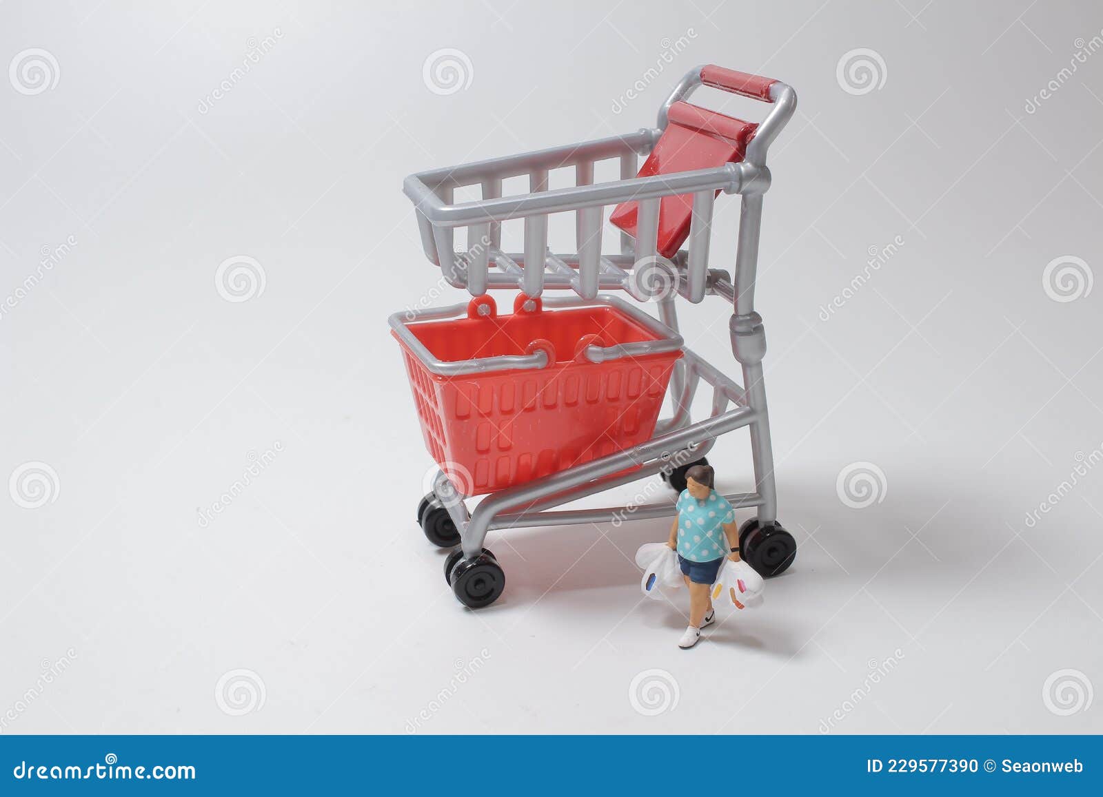 A Shopping Cart with the Mini Figure Stock Photo - Image of white, cart ...