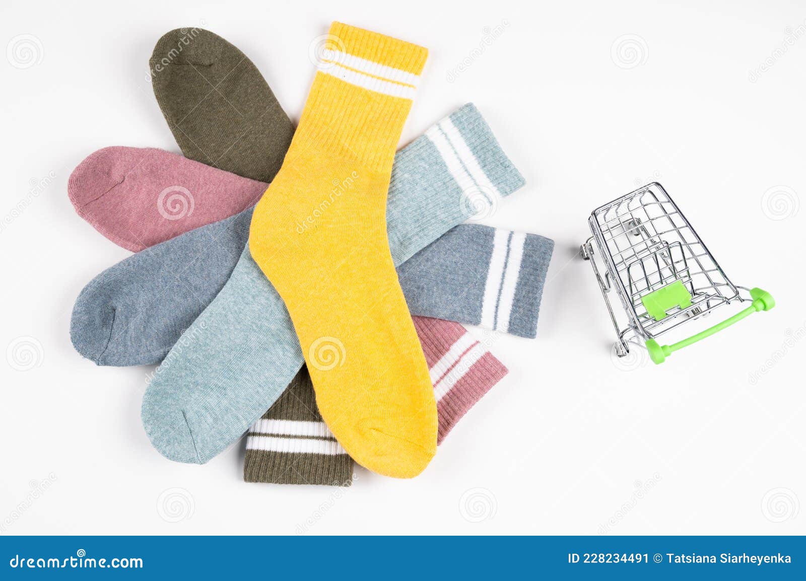 Shopping Cart and a Stack of Multi Colored Socks. Consumer Shopping ...