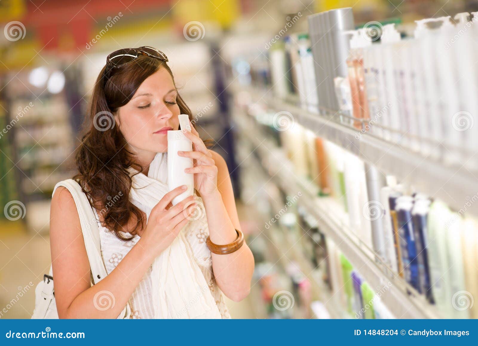 Shopping Cosmetics - Woman Smelling Shampoo Stock Photo - Image of ...
