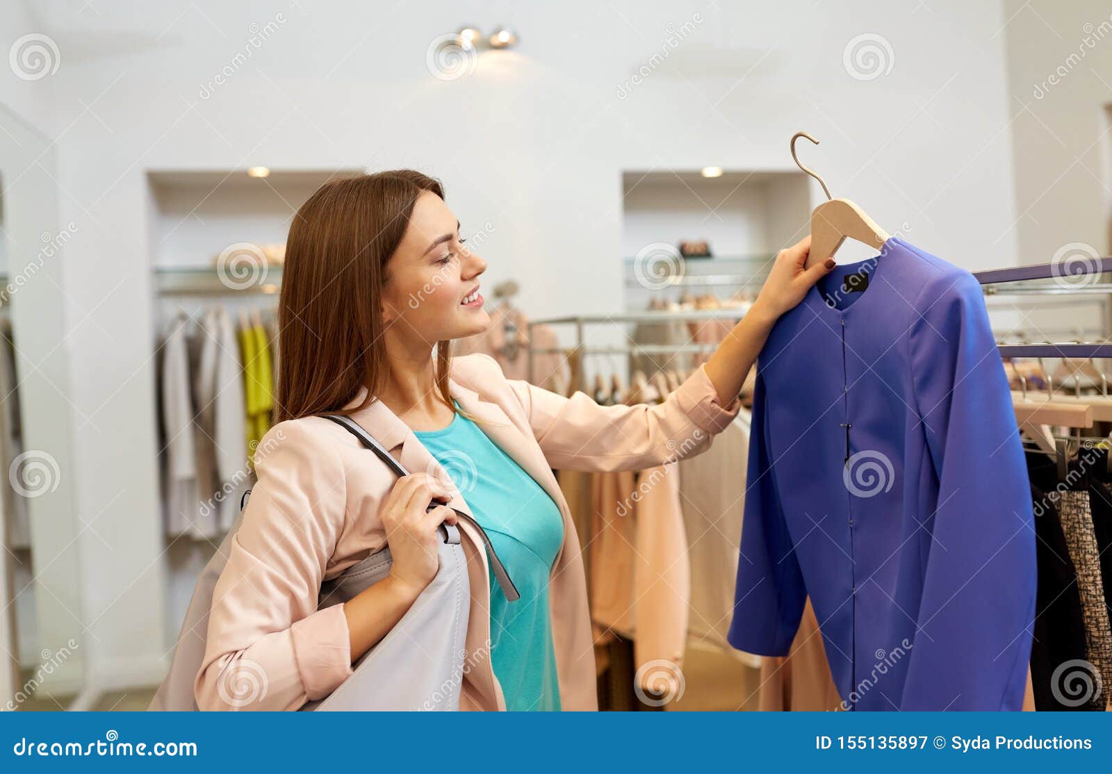 Happy Woman Choosing Clothes at Clothing Store Stock Image - Image of ... Happy Woman Choosing Clothes at Clothing Store Stock Image - Image of ...