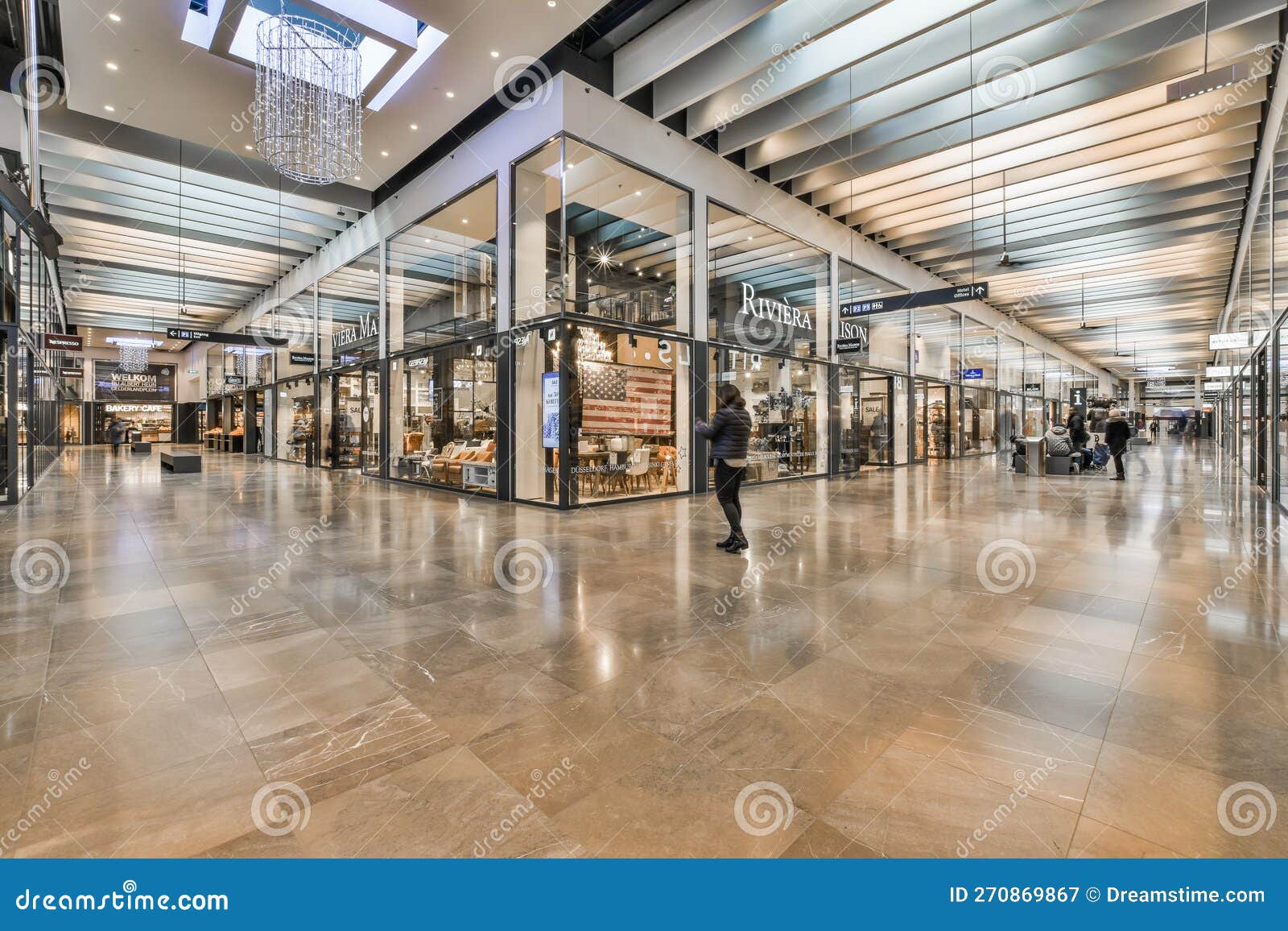 A Shopping Mall with People Walking Around and a Store Editorial ...
