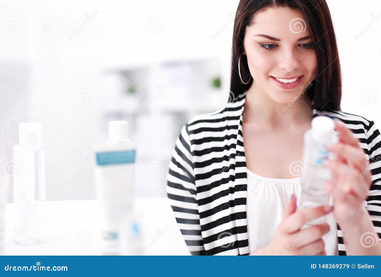 Shopping - Young Woman Holding Bottle of Shampoo in Supermarket Stock ... Shopping - Young Woman Holding Bottle of Shampoo in Supermarket Stock ...