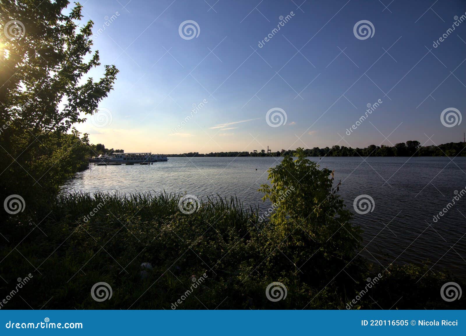 Shore of a Lake Framed by Trees in an Italian Town at Sunset Stock ...
