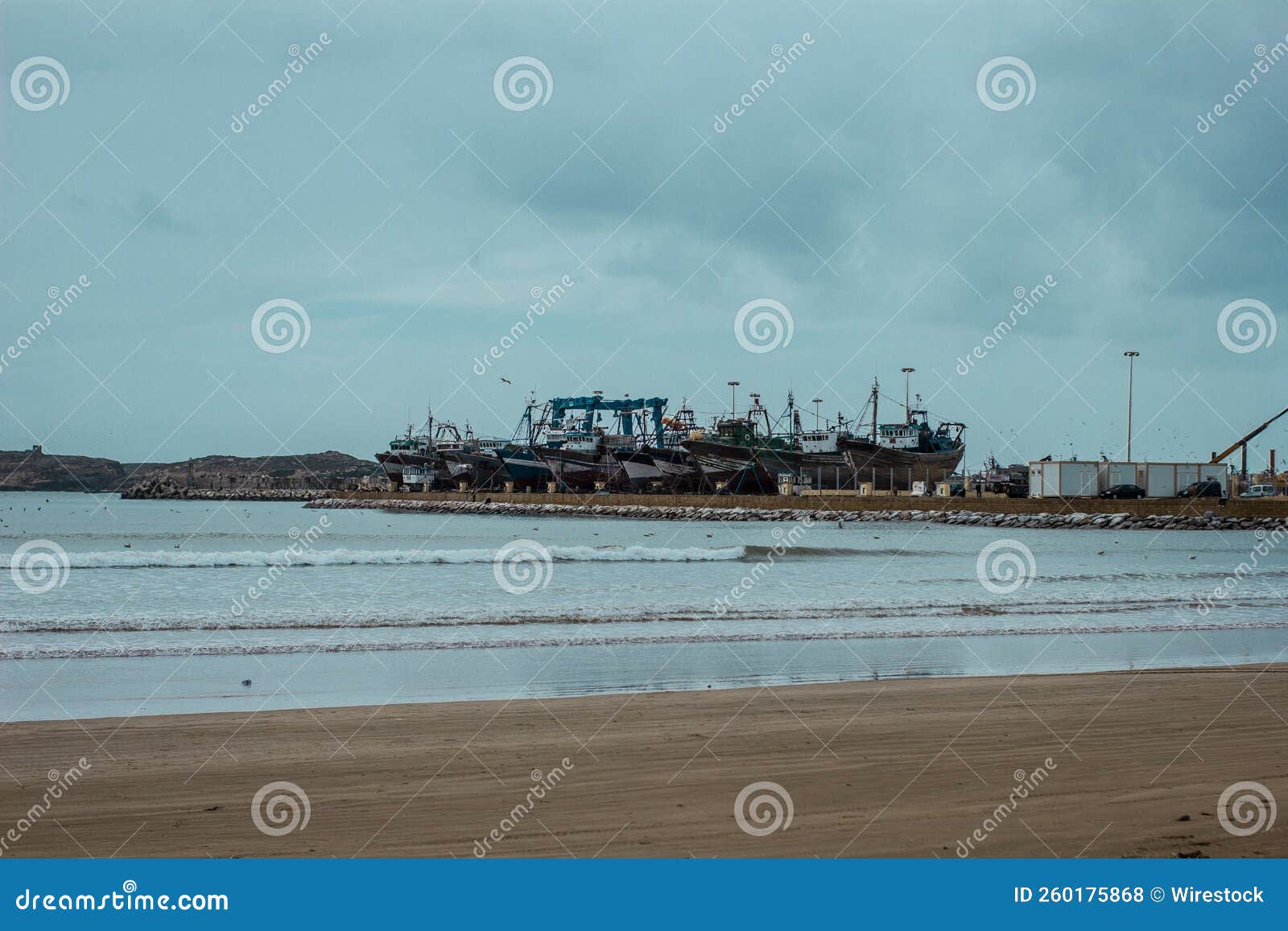 Shoreside View of the Ships Parked in a Harbor on the Coast Under the ...