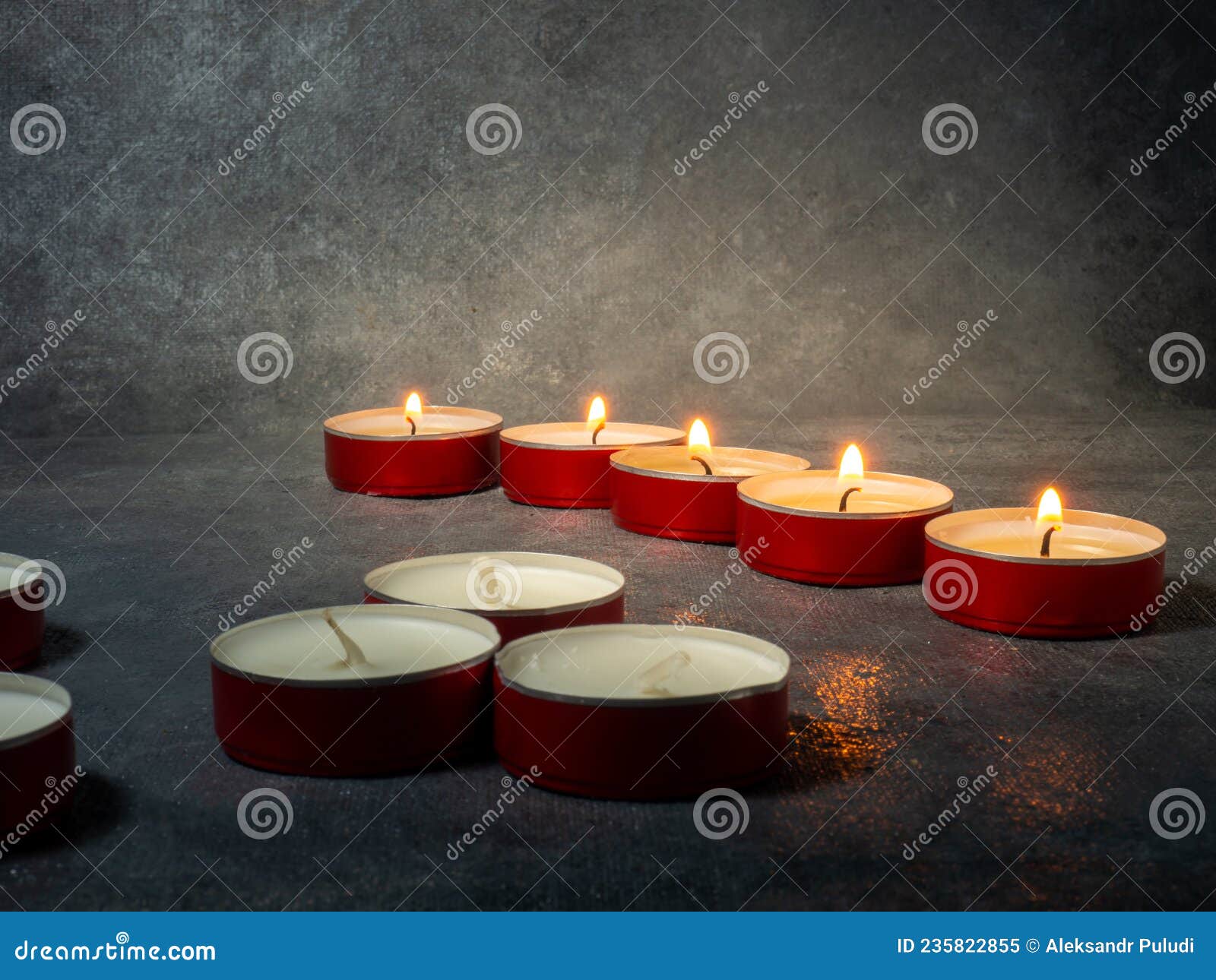 Short Candles are Burning on a Dark Surface. Lots of Small Candles ...