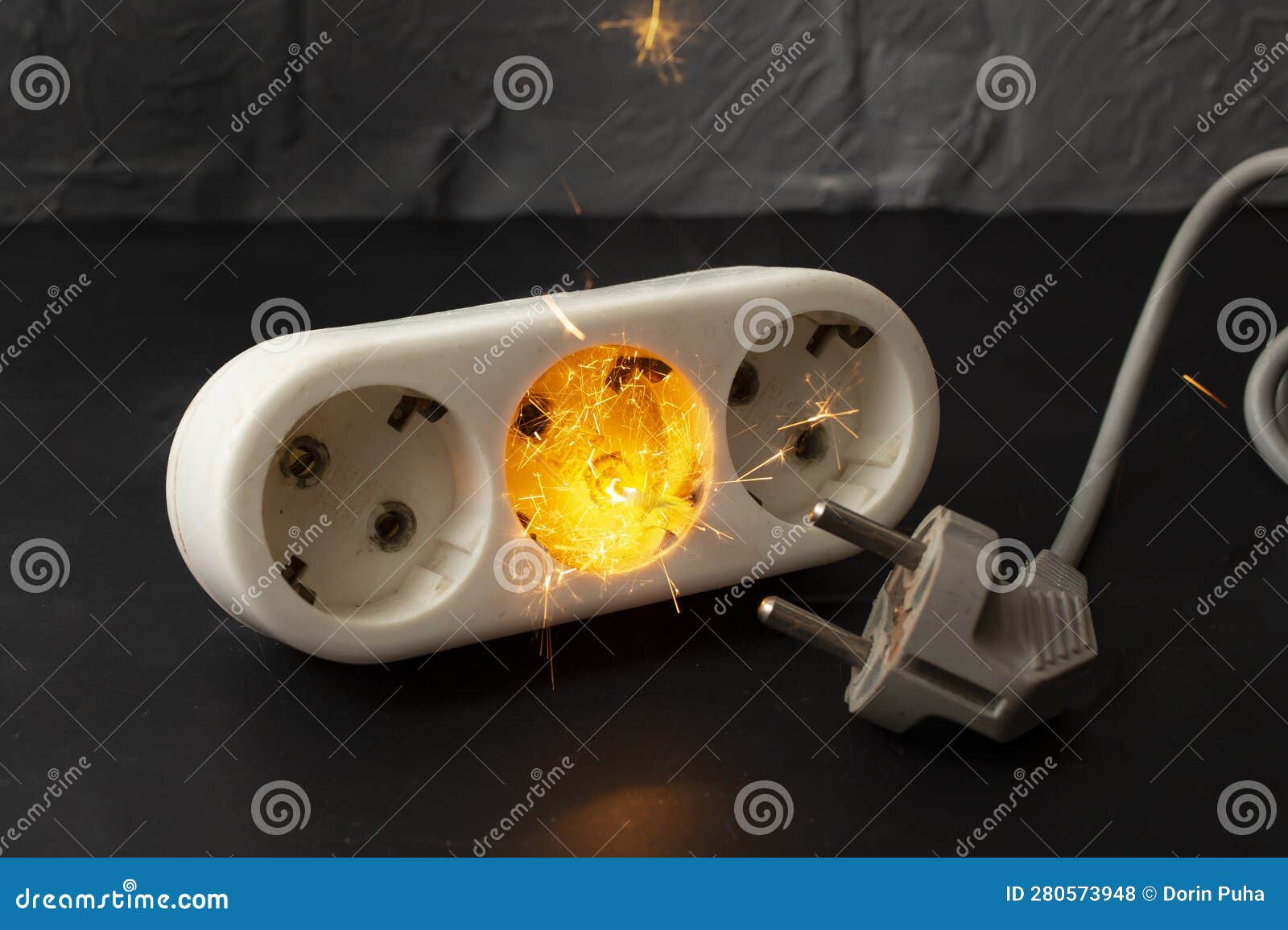 Short Circuit Sparks and Flame in a Outlet with an Electrical Cord ...