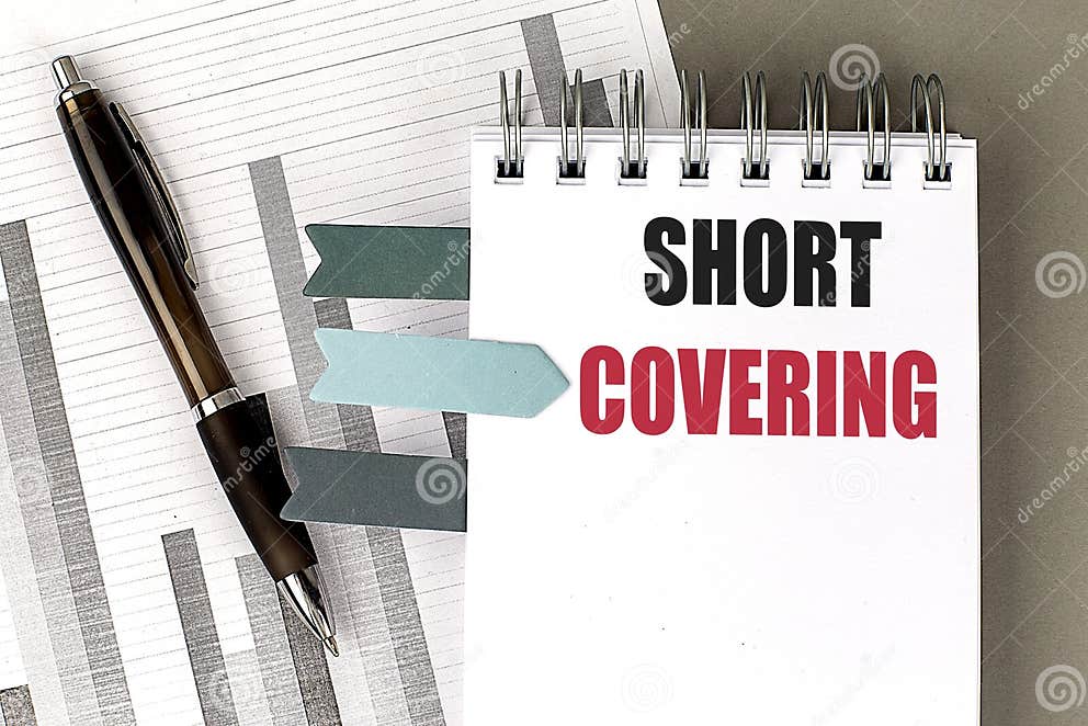 SHORT COVERING Text on Notebook with Chart on Gray Background Stock ...