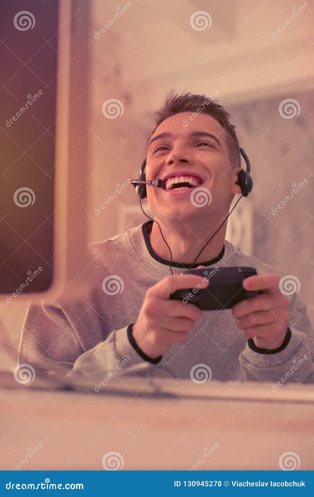 Short Haired Gamer Openly Smiling while Playing Stock Photo - Image of ...