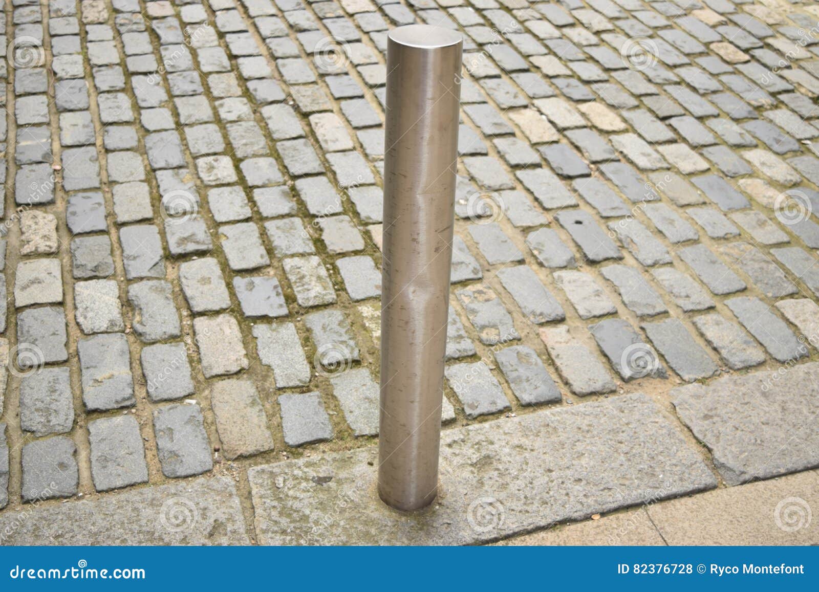 Short Metal Pole in the Middle of the Pavement Stock Photo - Image of ...
