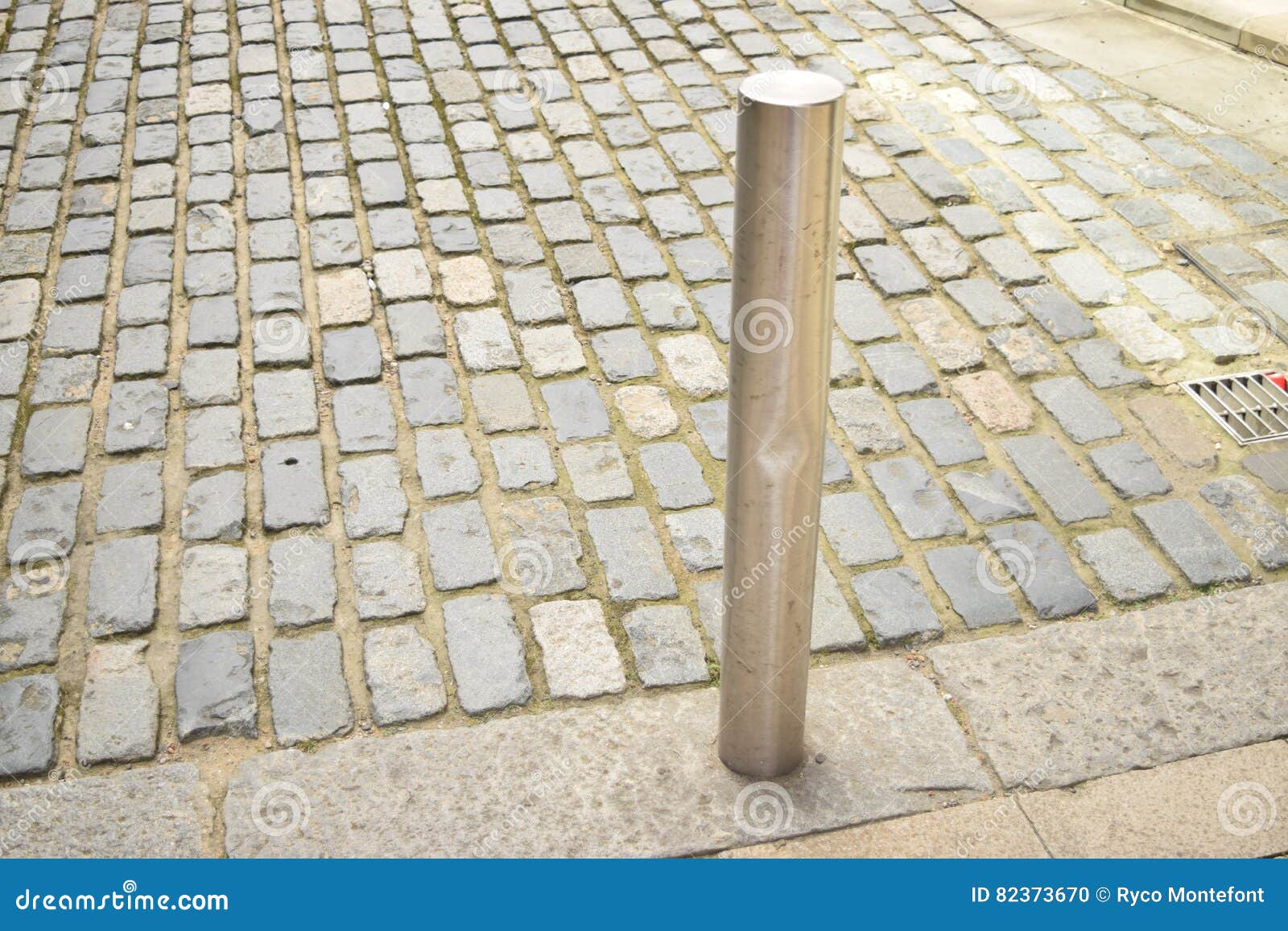 Short Metallic Pole on a Stone Pavement Stock Photo - Image of outdoors ...