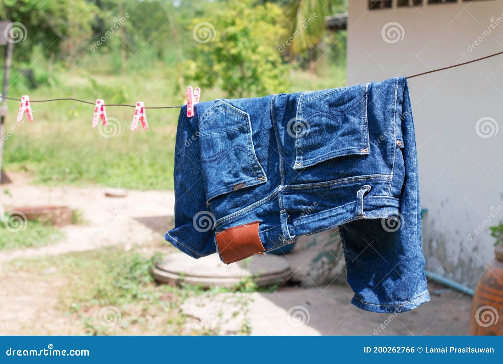 Shorts Blue Jeans Hanging for Drying in Sunlingt Stock Photo - Image of ...