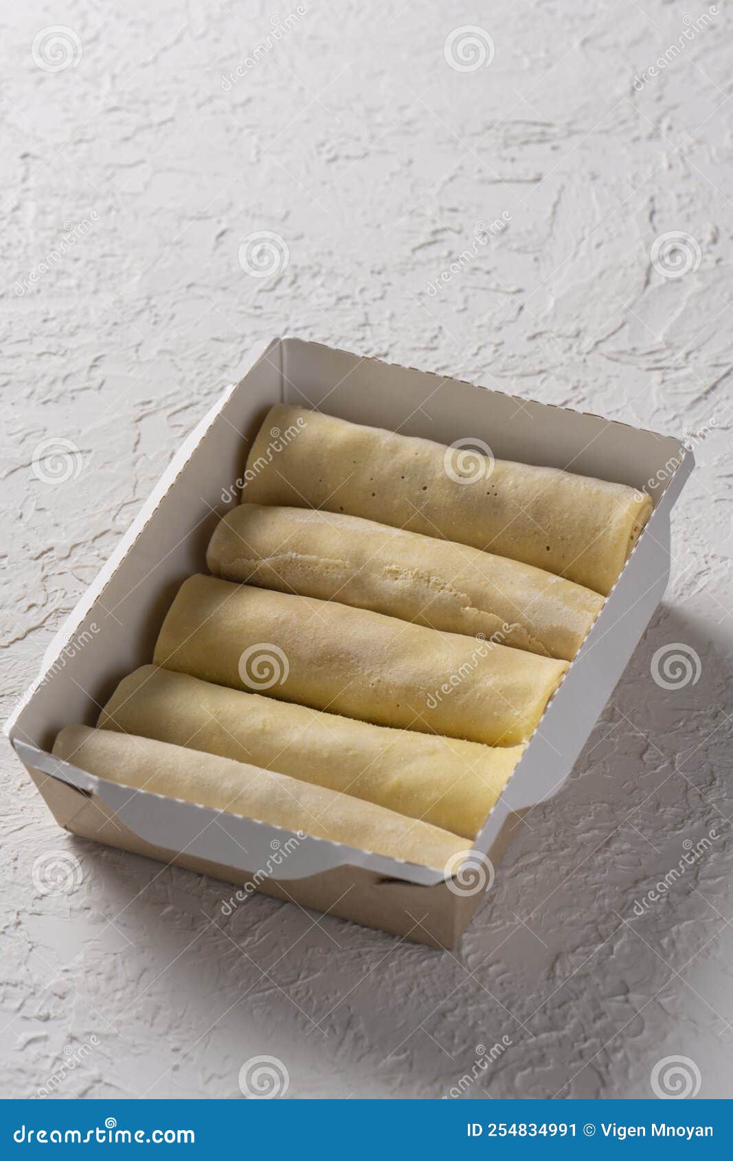 Shot of Box of Rolled Crepes on White Tabletop Stock Image - Image of ...