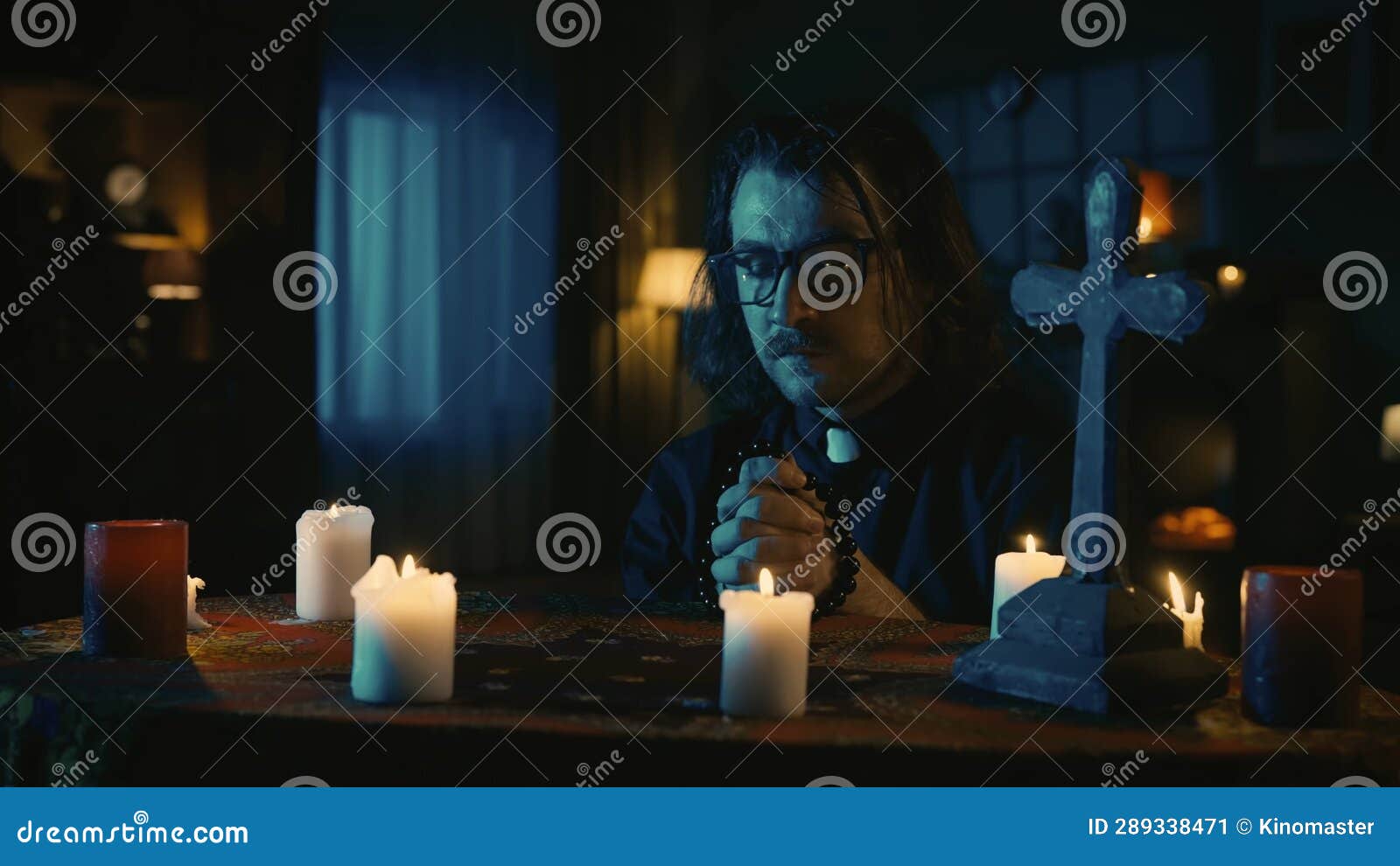 Shot Capturing a Table with Magical Tools on it. a Priest is Sitting at ...