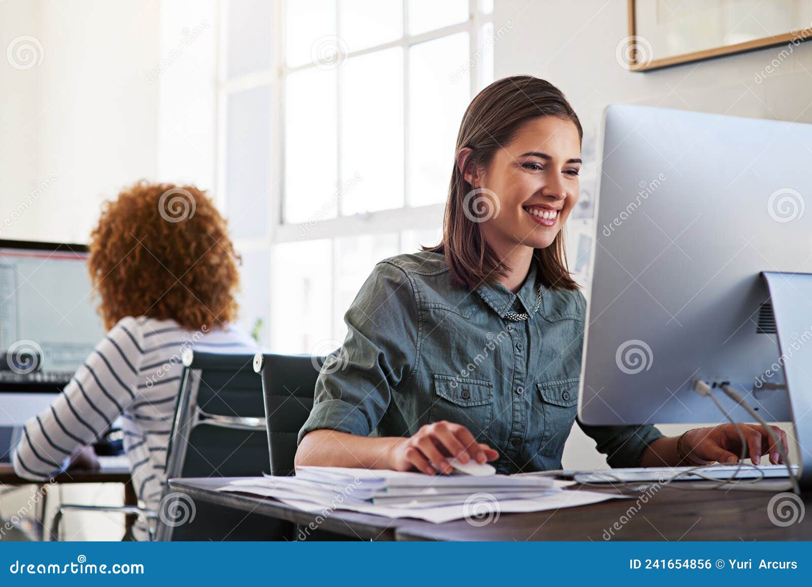 Getting Work Done with a Positive Attitude. Shot of Colleagues Working ...