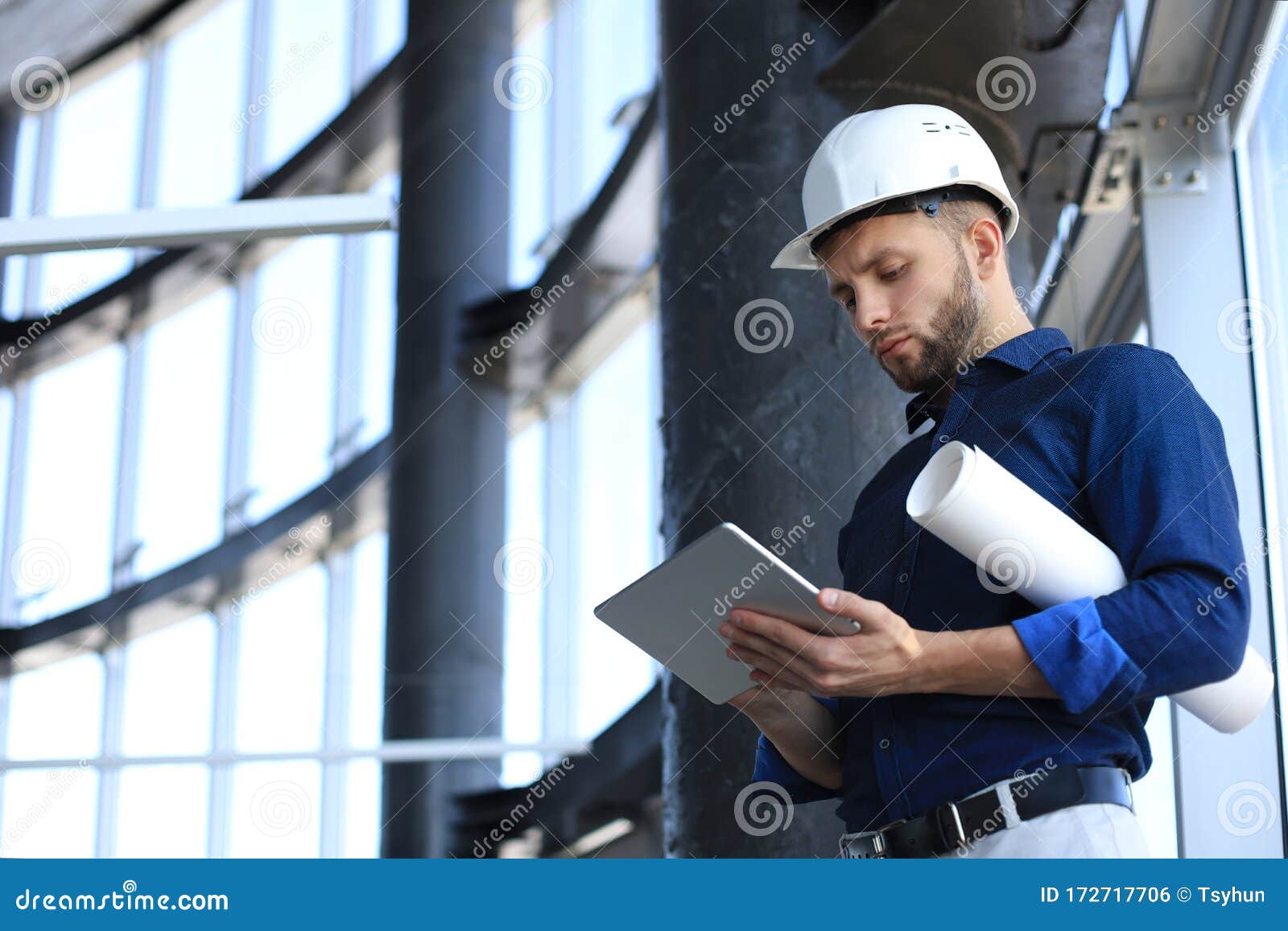 Shot of a Engineer Using a Digital Tablet on a Construction Site. this ...