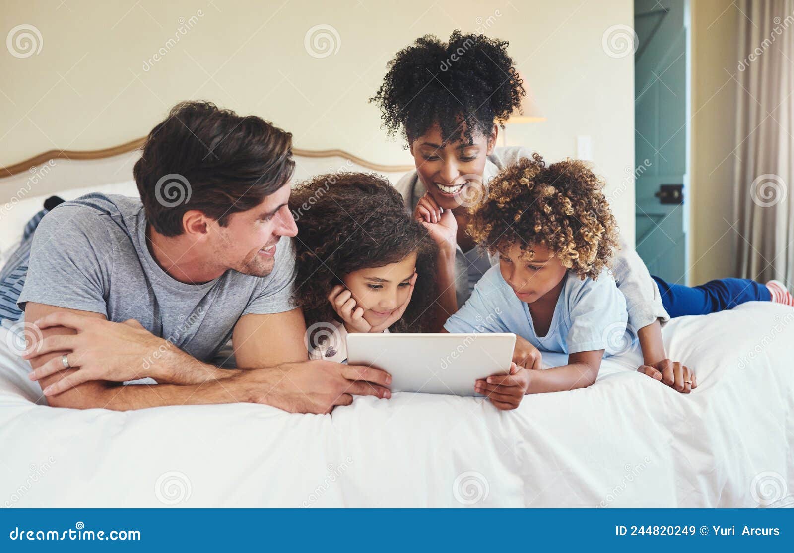 Technology Educates and Entertains. Shot of a Family Using a Digital ...