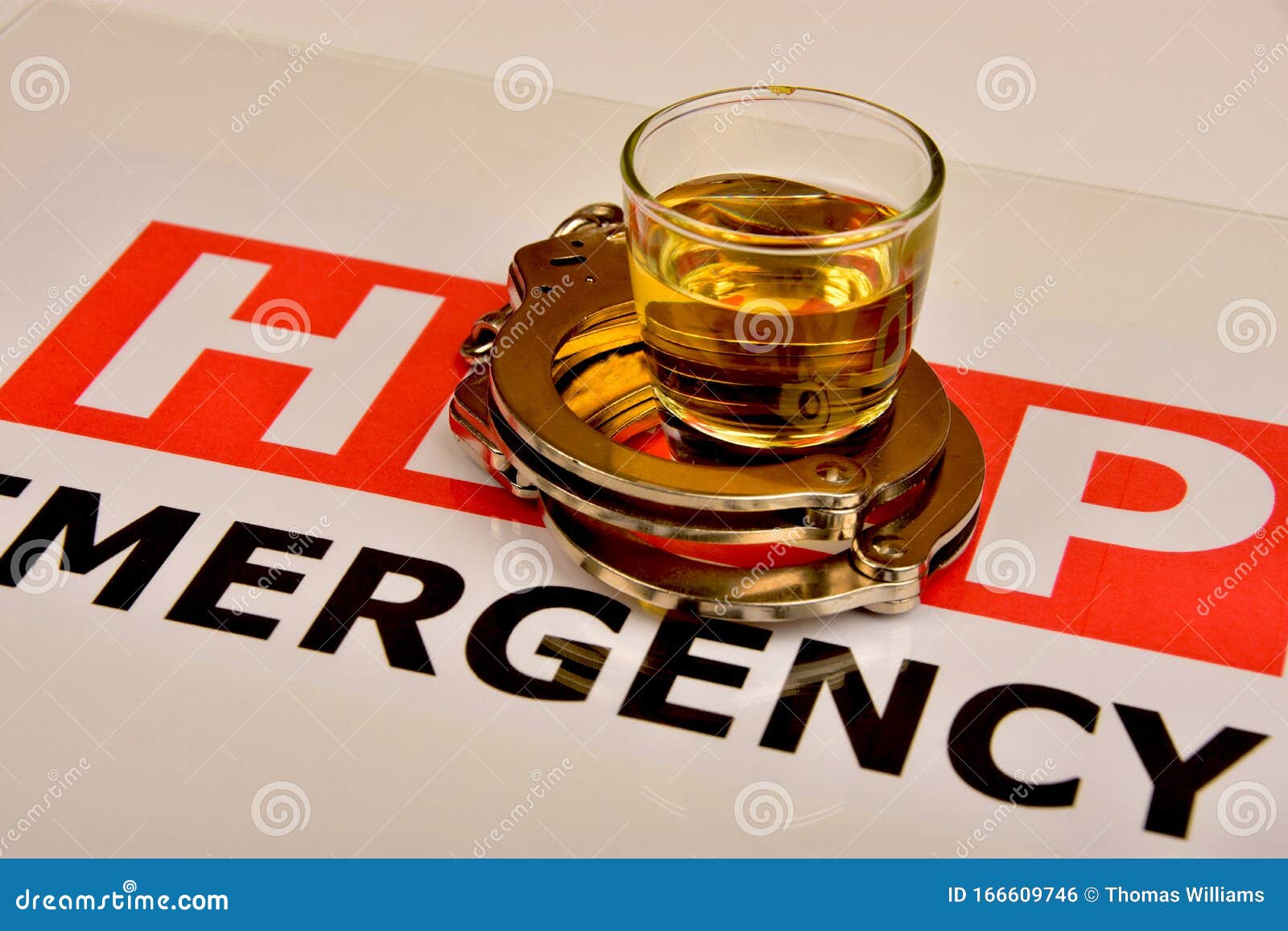 Shot Glass in Handcuffs on Sign Symbolizing Alcohol Dependency. Stock ...