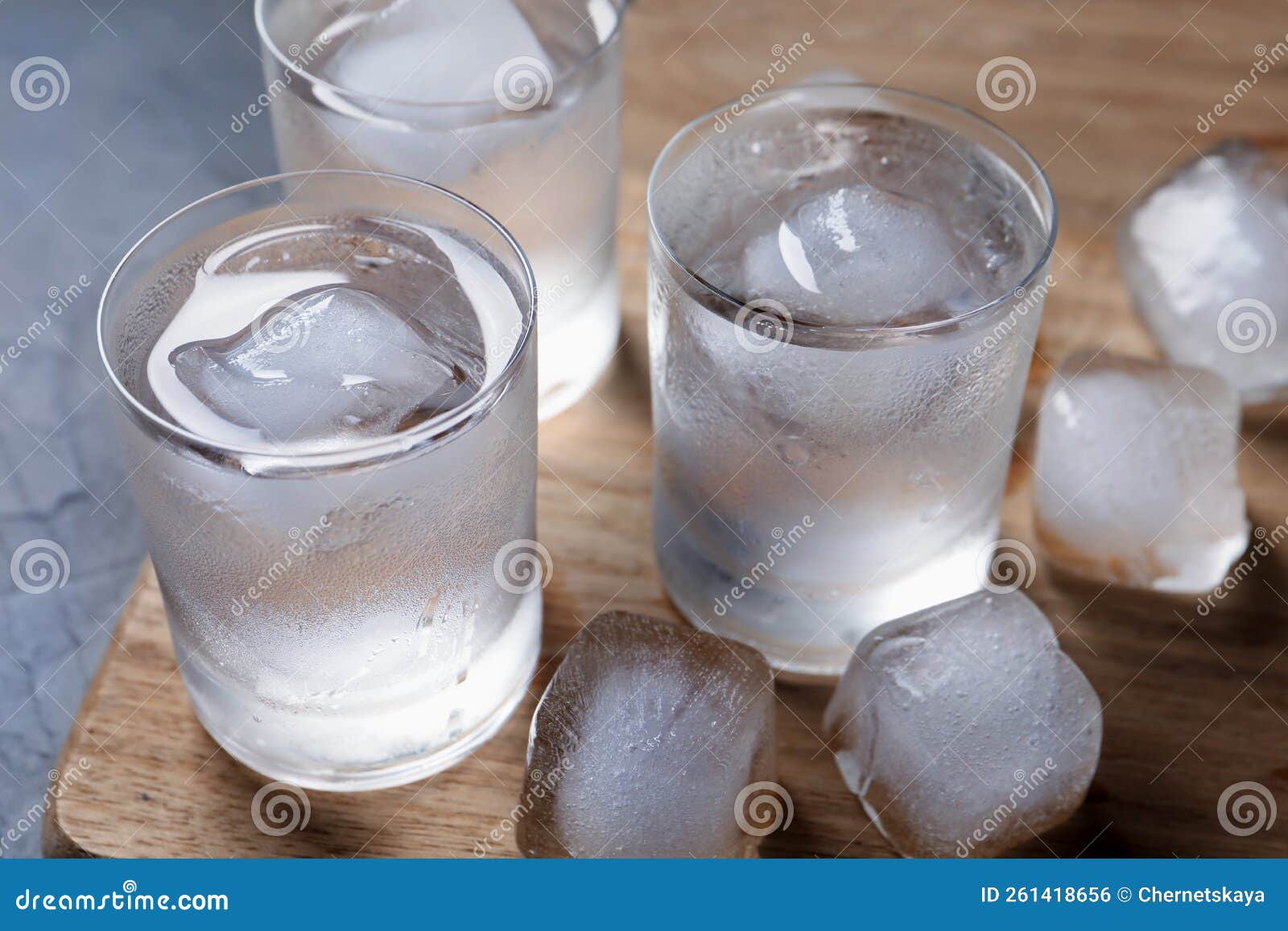 Shot Glasses of Vodka with Ice Cubes on Table, Closeup Stock Photo ...