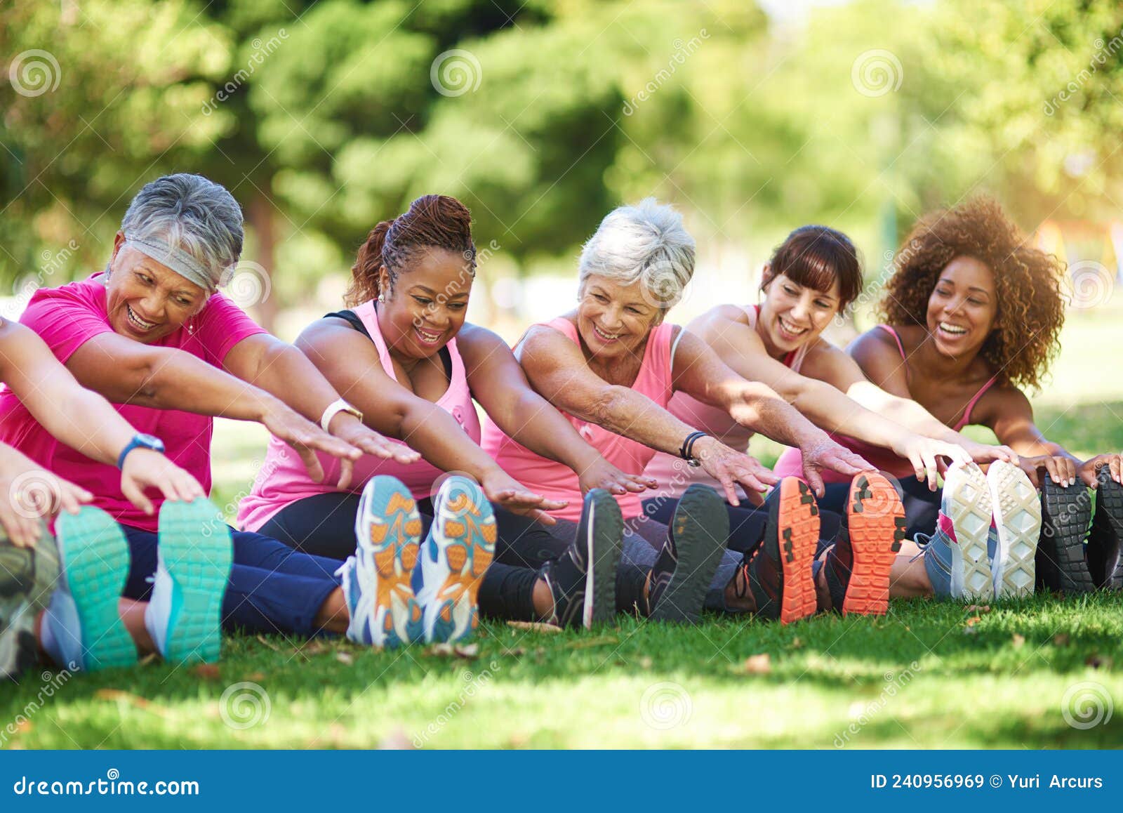 Having a Laugh while Limbering Up. Shot of a Group of People Warming Up ...
