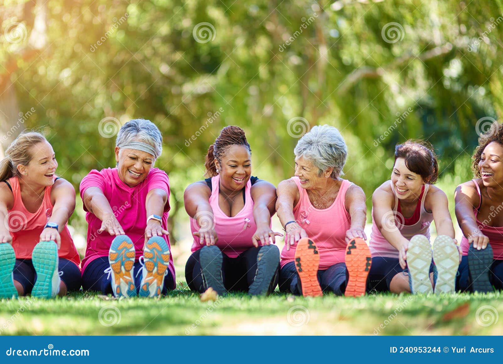 Limbering Up before Exercise. Shot of a Group of People Warming Up ...