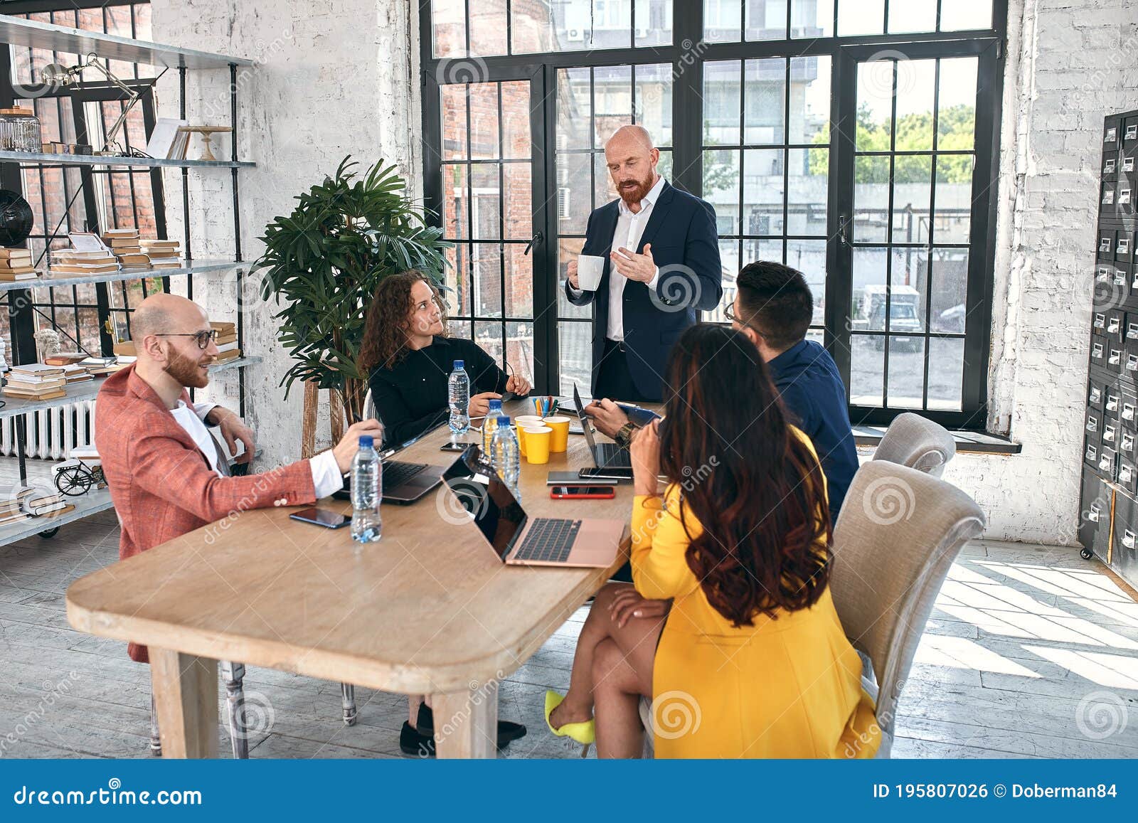 Shot of a Group of Young Business Professionals Having a Meeting ... Shot of a Group of Young Business Professionals Having a Meeting ...