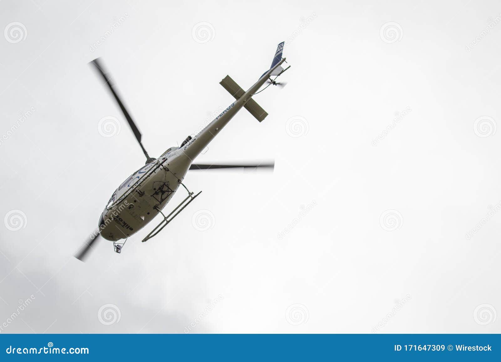 Shot of a Helicopter from Below Against a White Sky Stock Image - Image ...