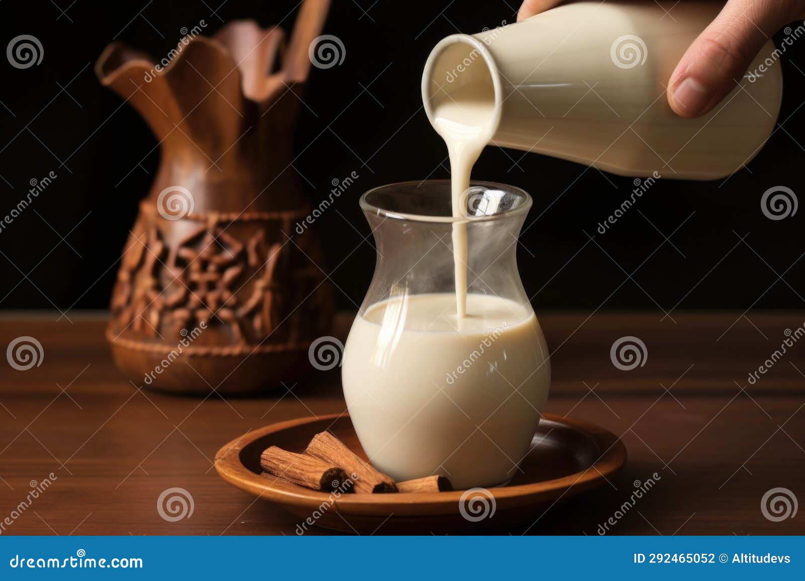 A Shot of Horchata Being Poured from a Traditional Pitcher Stock Photo ...