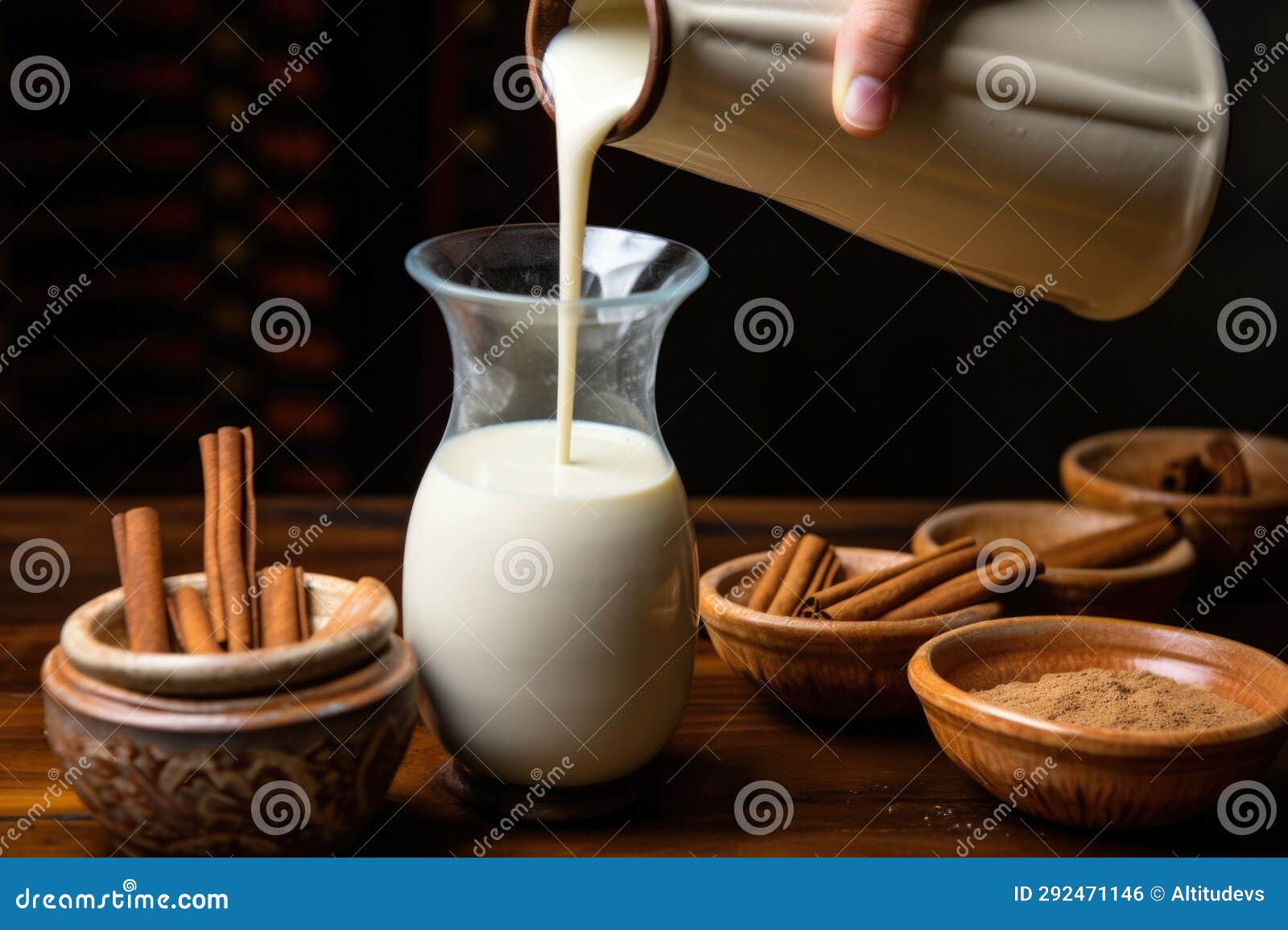 A Shot of Horchata Being Poured from a Traditional Pitcher Stock Photo ...