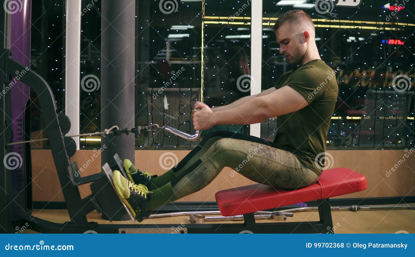 Shot in 4k: Side View of a Man in Gym Doing Pulls Back with Weight ...