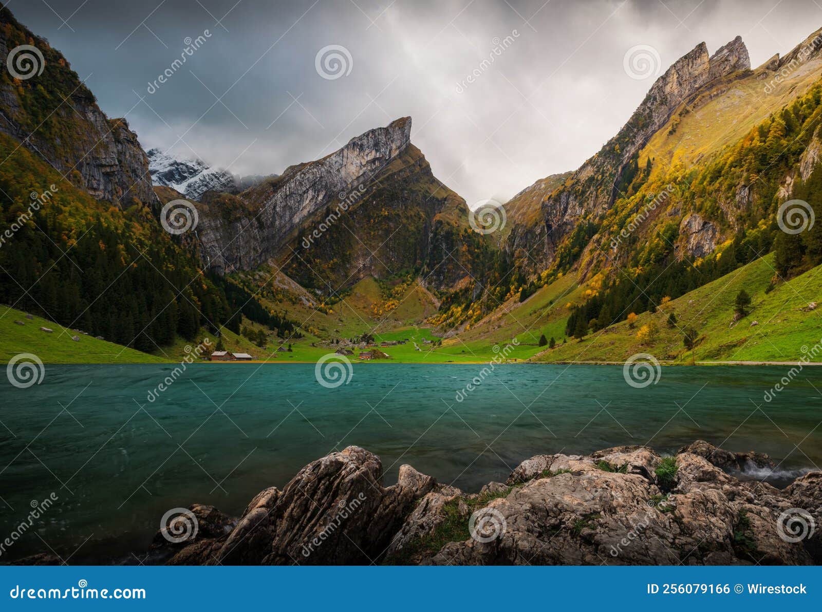 Shot of a Lake in between Mountains on a Sunny Day Stock Photo - Image ...