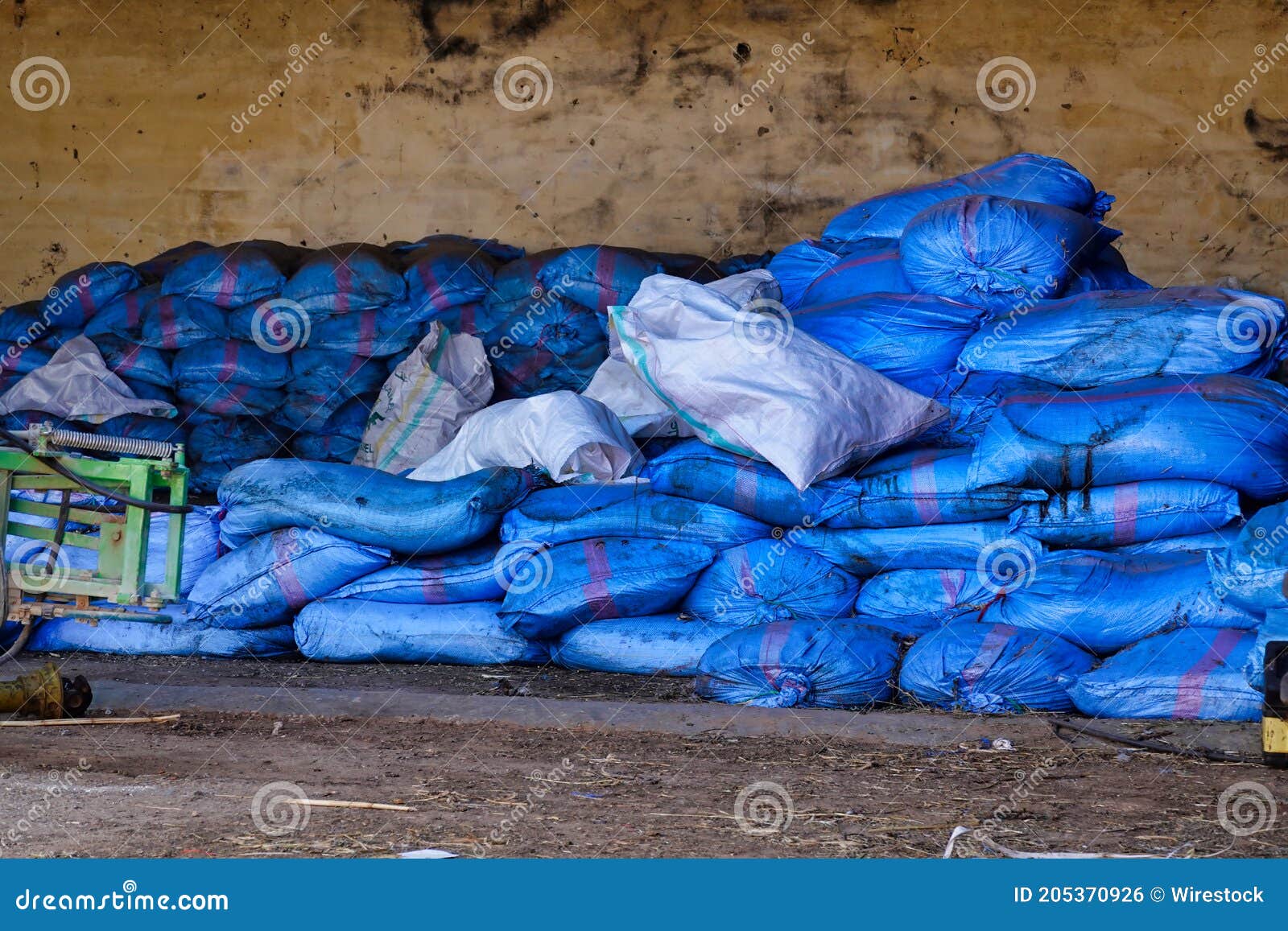 Shot of Many Blue Sacks Near a Wall Stock Photo - Image of bags ...