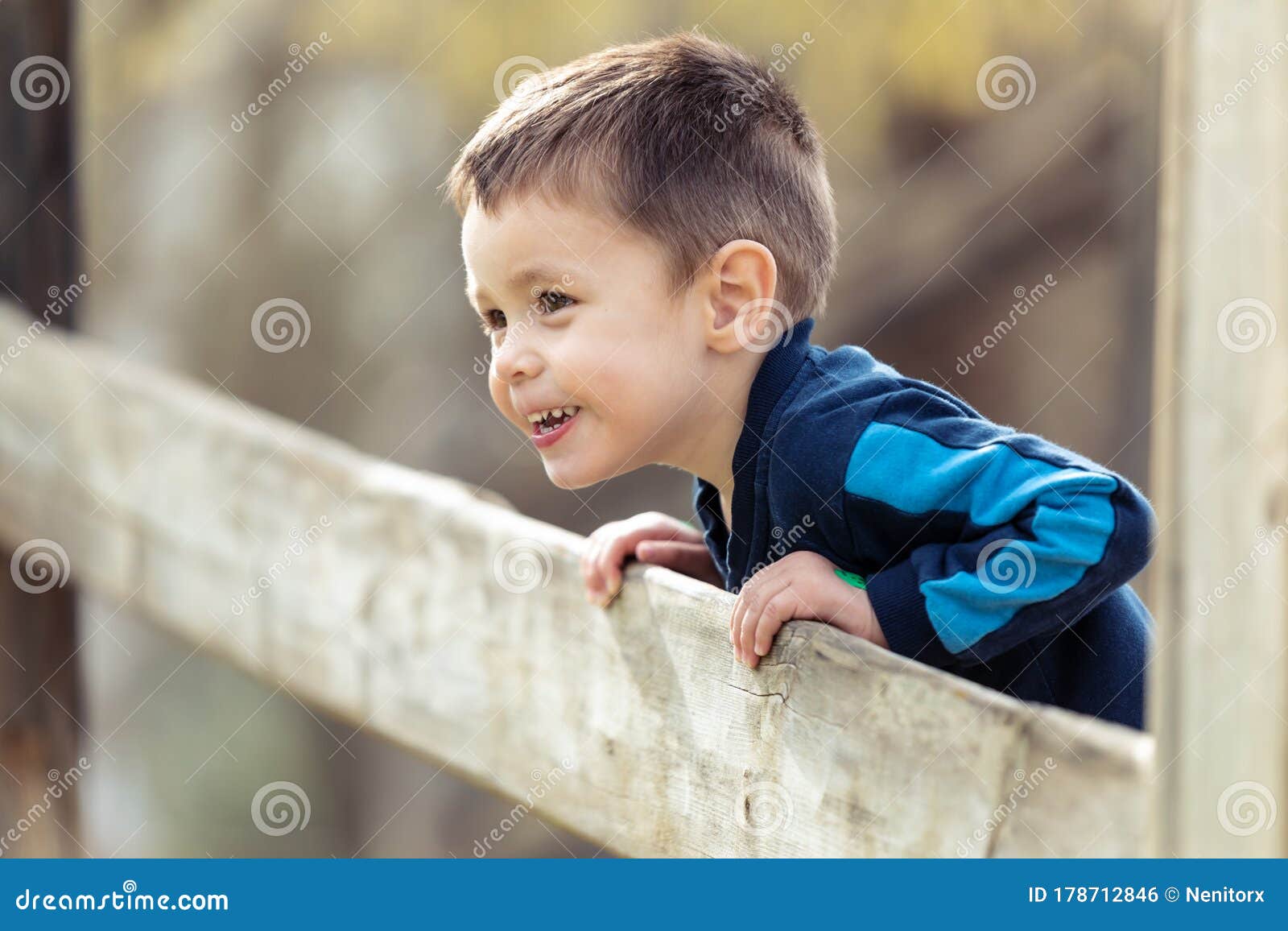 Nice Little Boy Looking Forward from the Bridge Outdoors Stock Photo ...