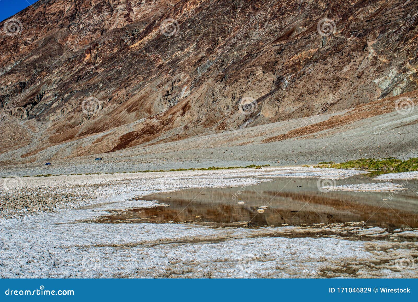 Shot of Partially Dried Puddle Ahead of the Rocky Foothill Stock Image ...