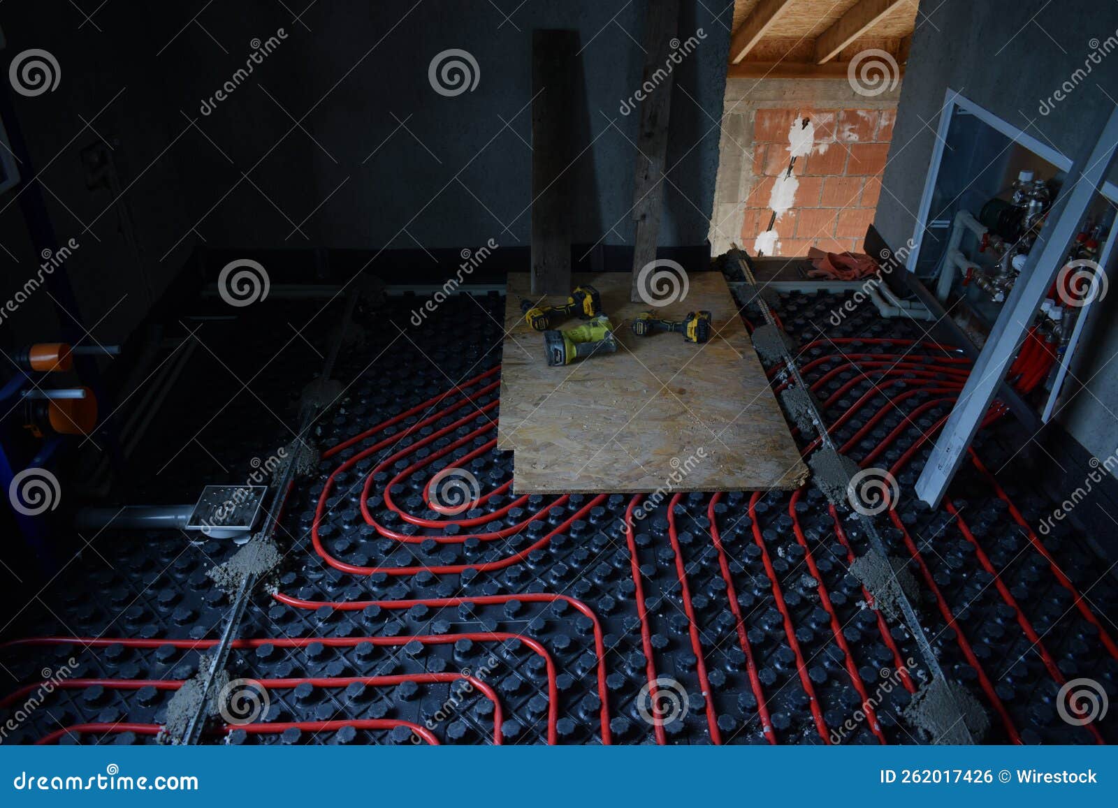 Shot of a Room Under Construction Equipped with Pipe and Fitting System ...