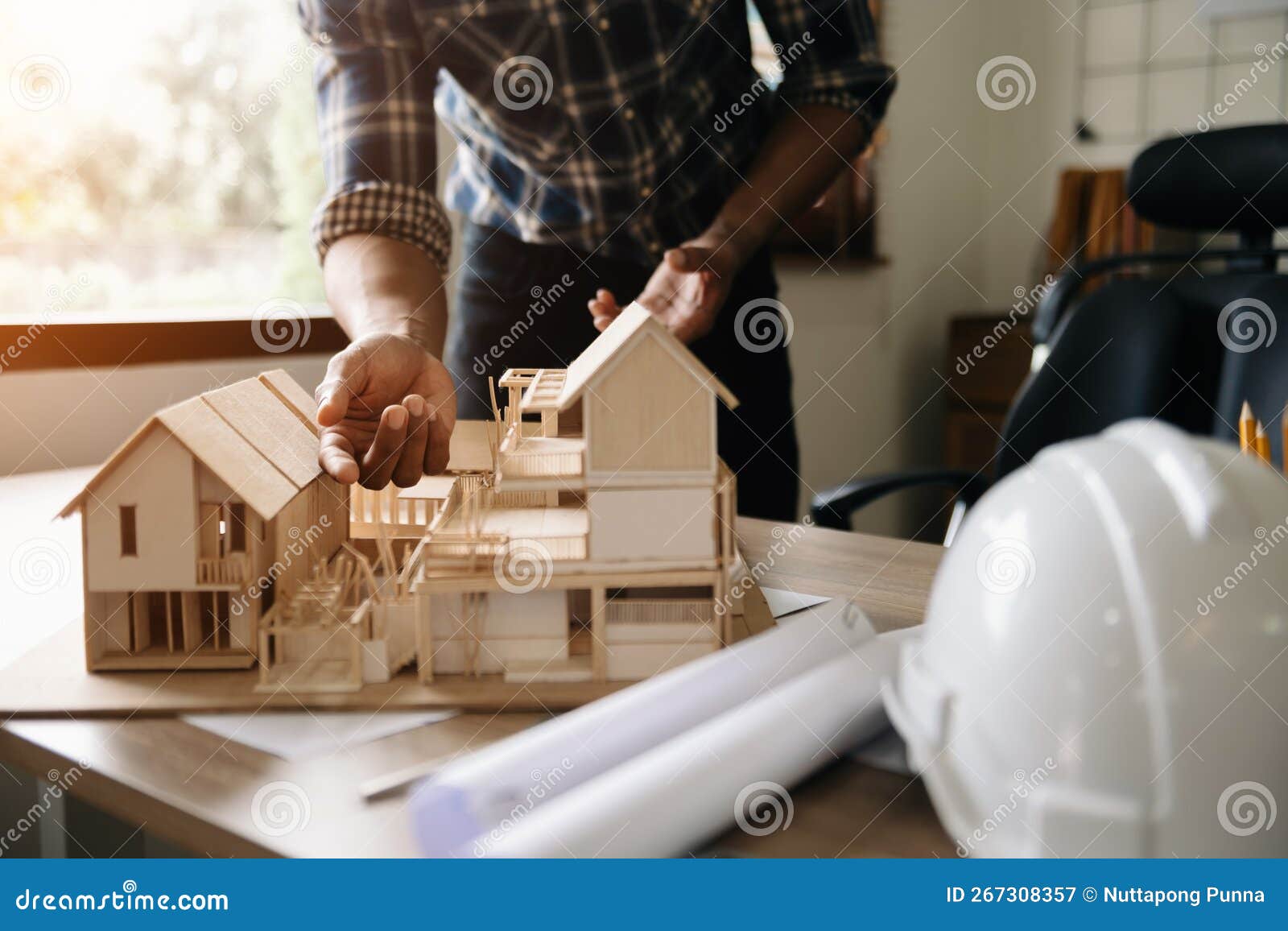 Shot of Scale Model House on Table with Architects. Two Architects ...