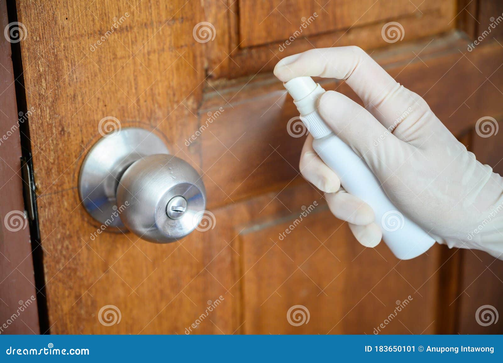 Shot of Someone Hand Using Alcohol Hand Sanitizer Spraying on the Door ...