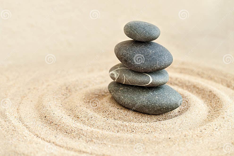 Sandy Serenity. Shot of a Stones Stack in Sand. Stock Photo - Image of ...
