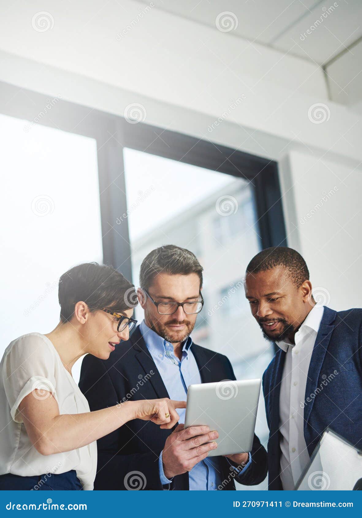 Teamwork and Technology - Invaluable Business Assets. Shot of a Team of ...