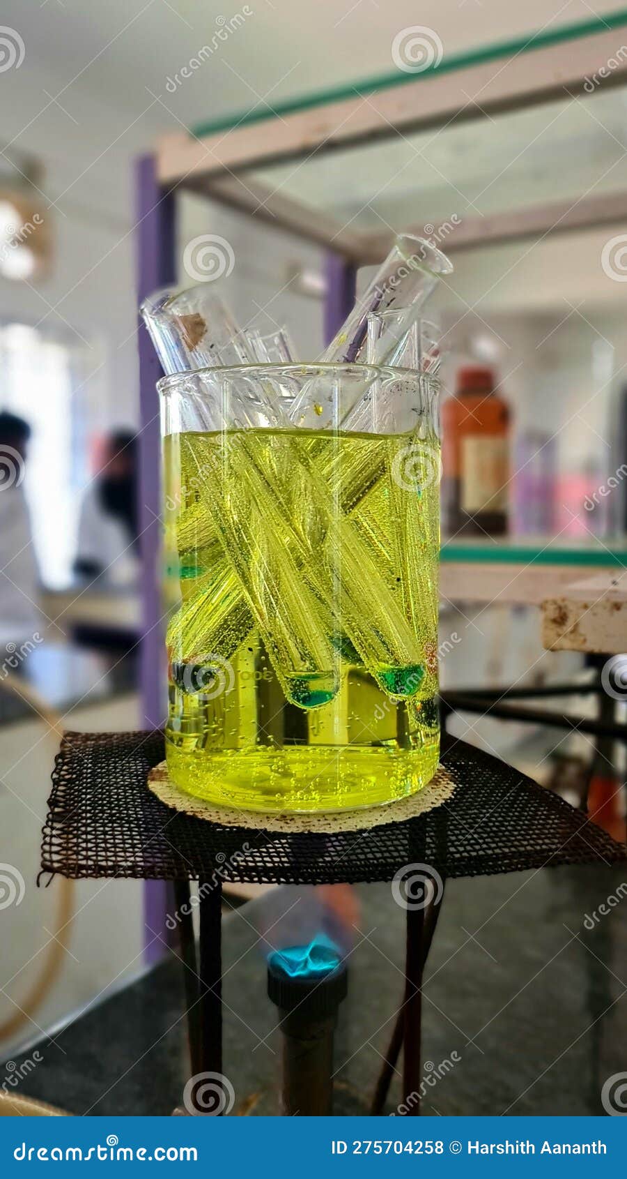 Shot of Test Tubes Floating on Green Coloured Reagents in a Beaker ...