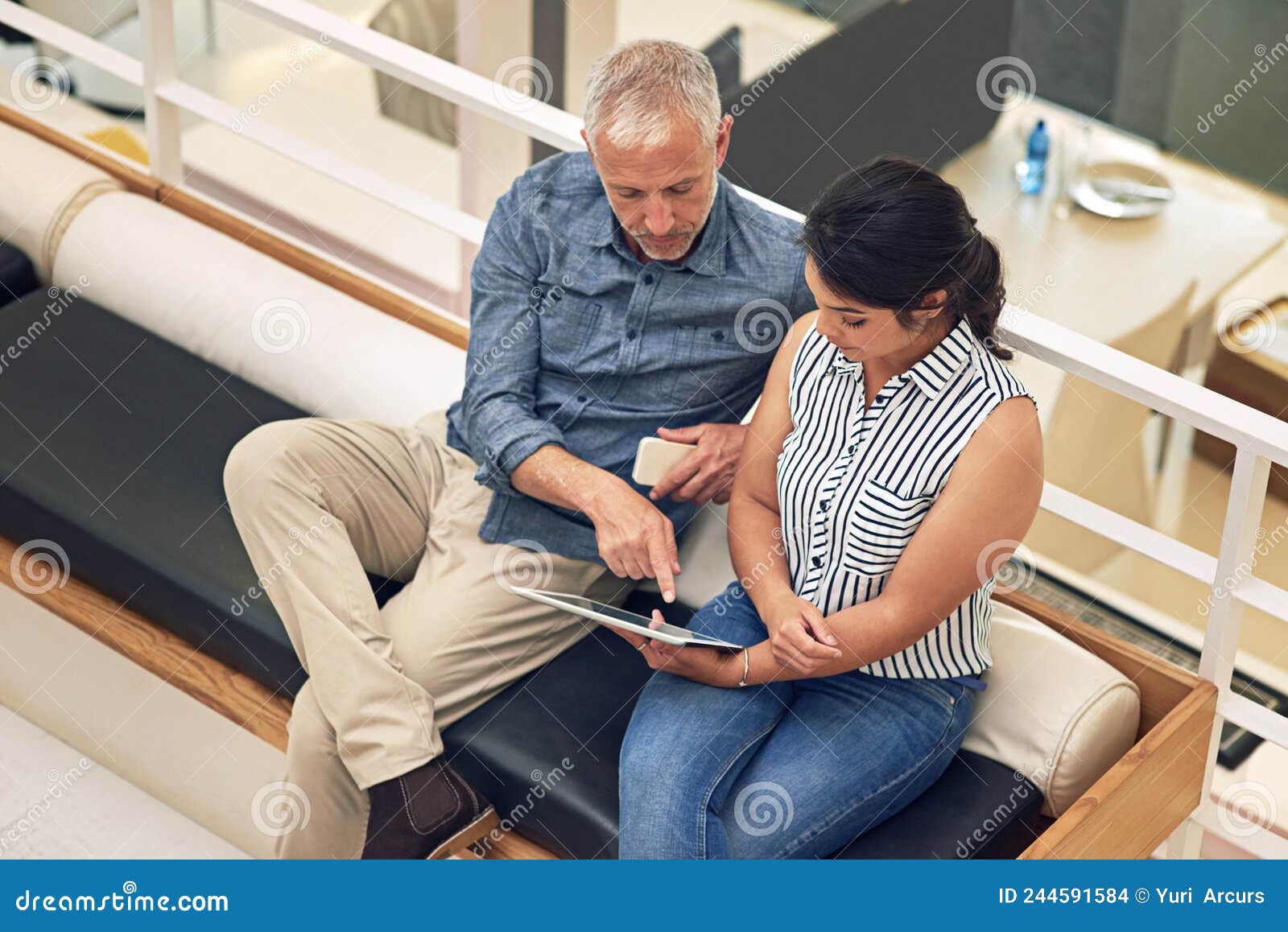 Knowledge Shared is Knowledge Gained. Shot of a Two Colleagues Using a ...