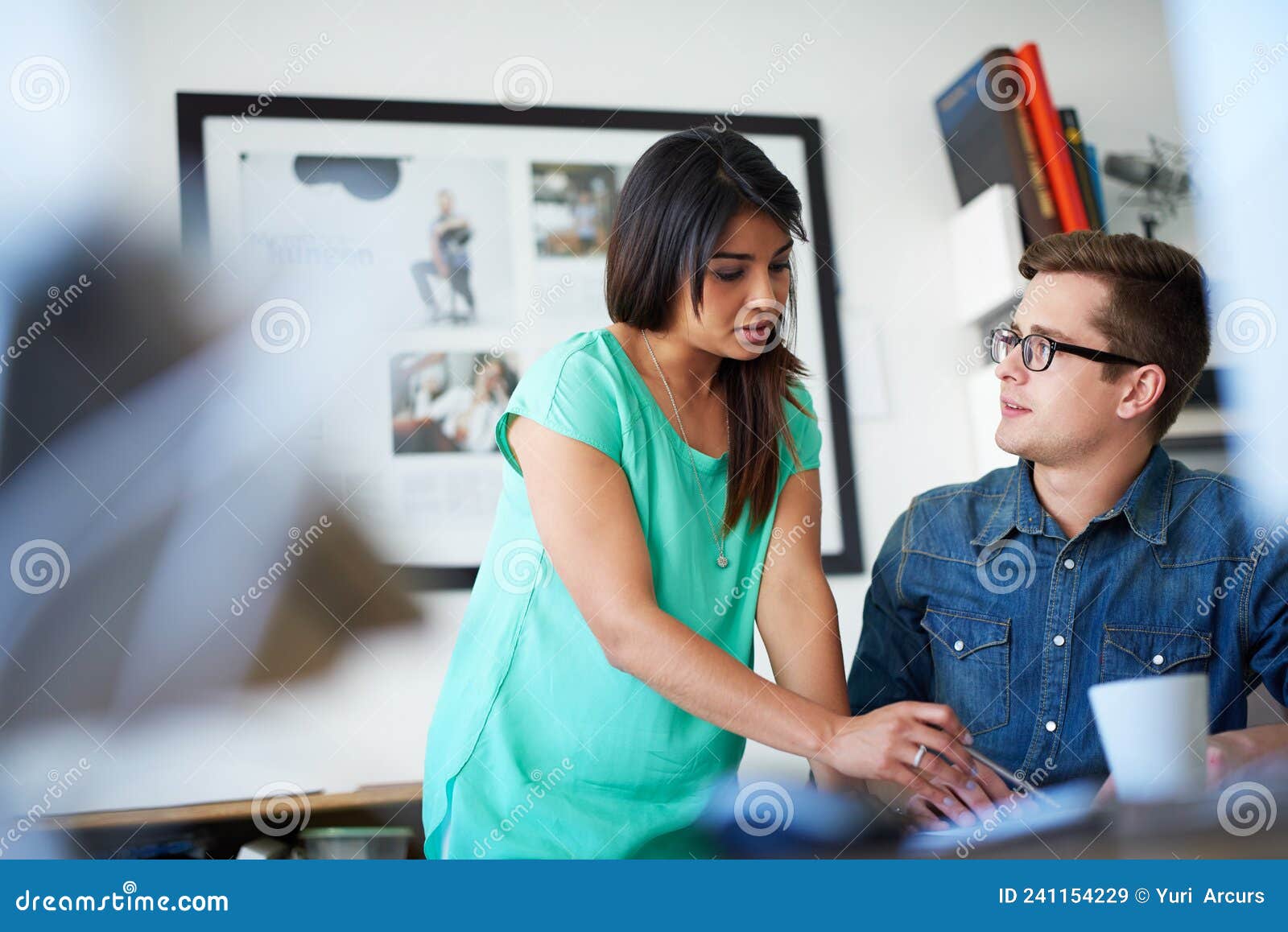 Combining Their Creative Powers. Shot of Two Designers Working Together ...